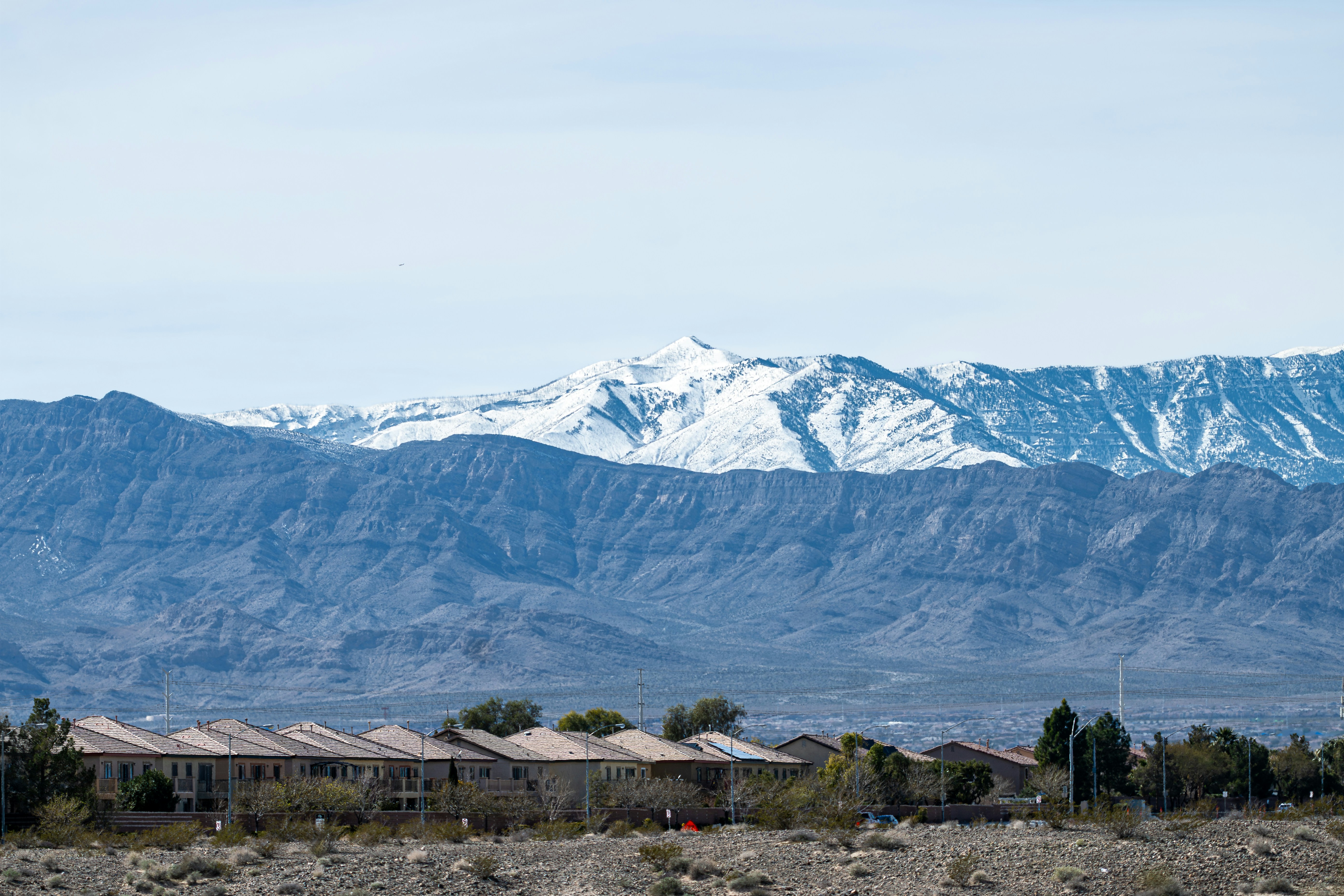 Snow-kissed Peaks Over Quiet Suburban Foothills