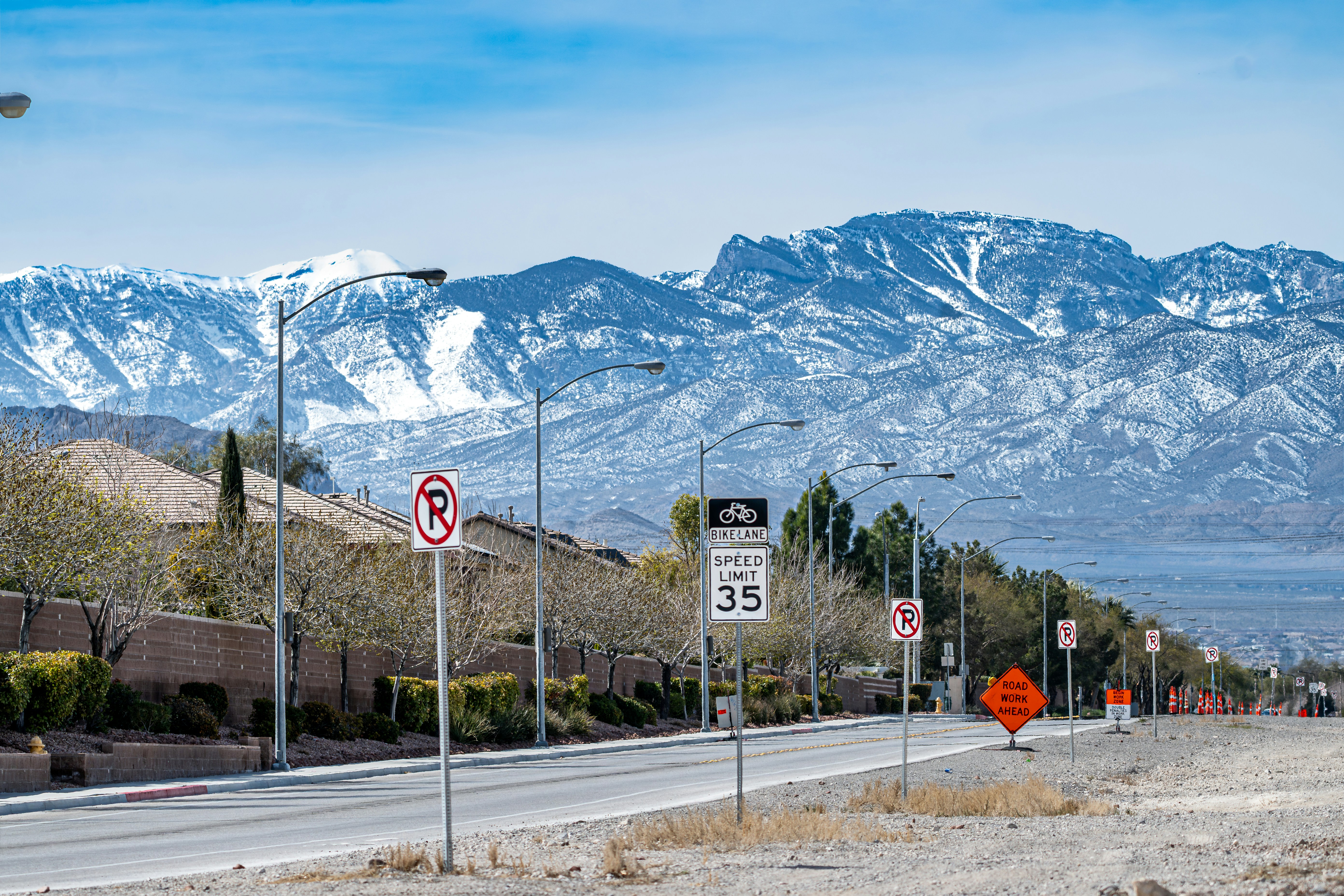 Mountain Backdrop Over Quiet Suburban Boulevard