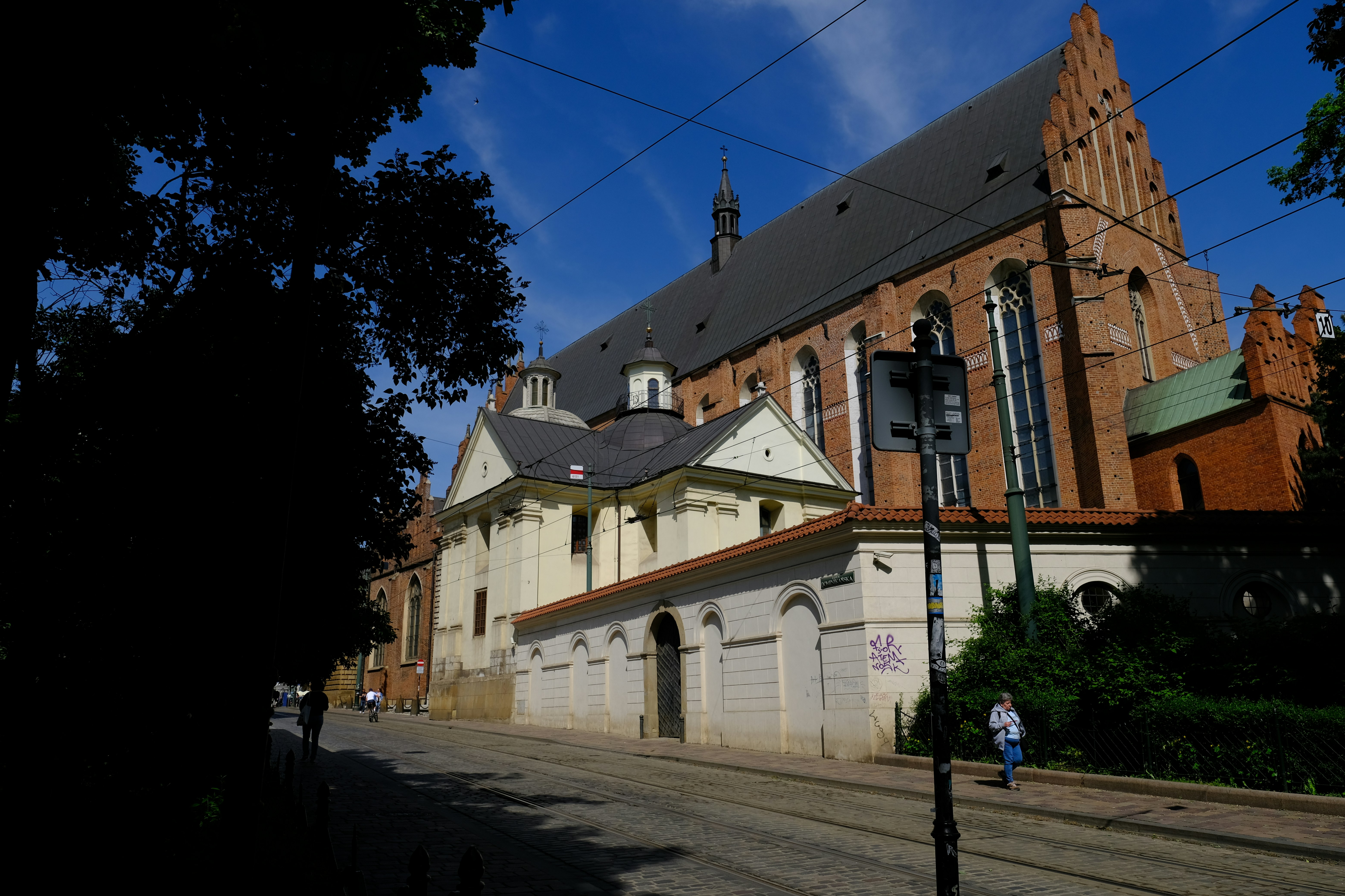 Gothic Cathedral and sunlit arcade along a quiet city street