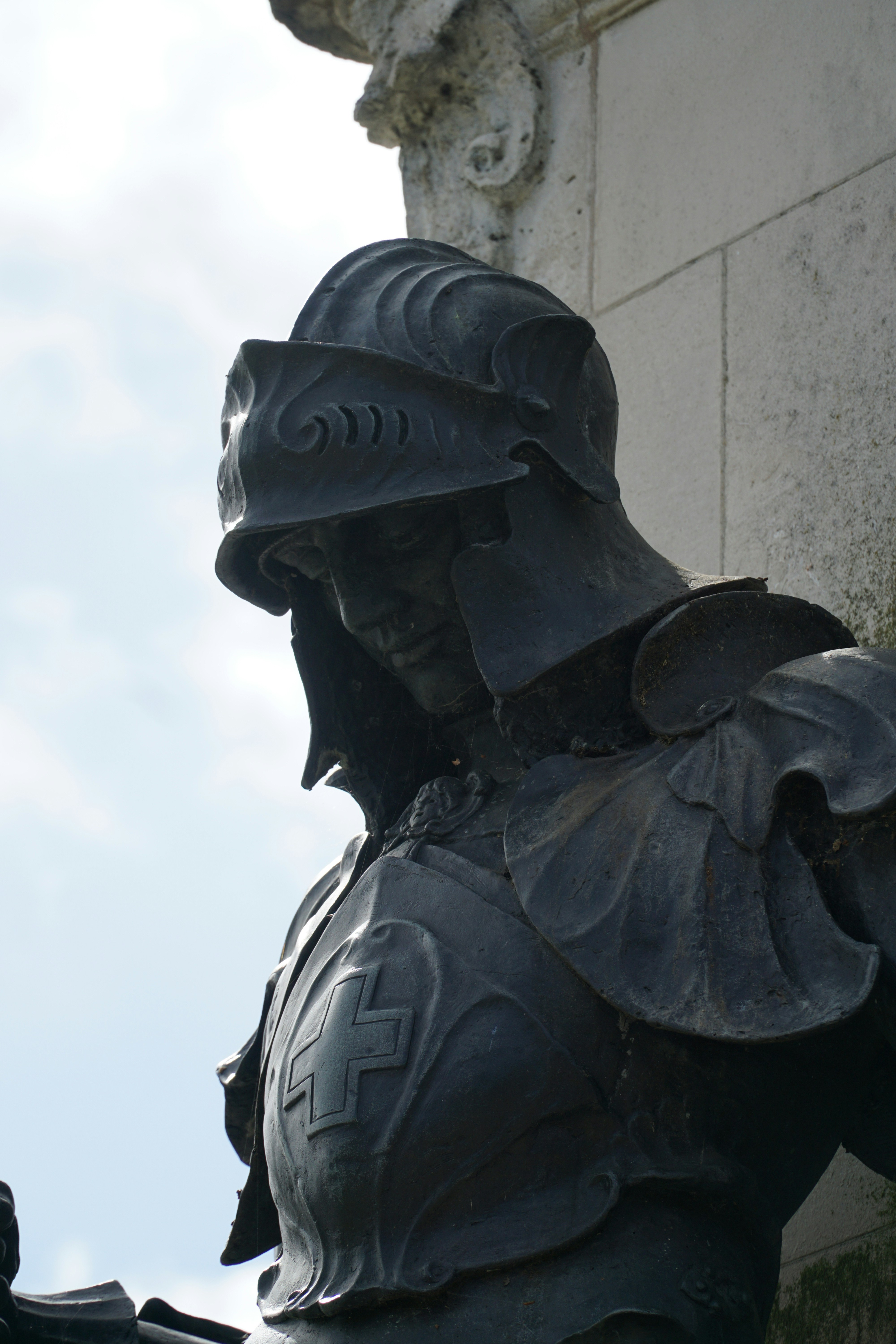 Steel Guardian: Knightly statue under stone ledge