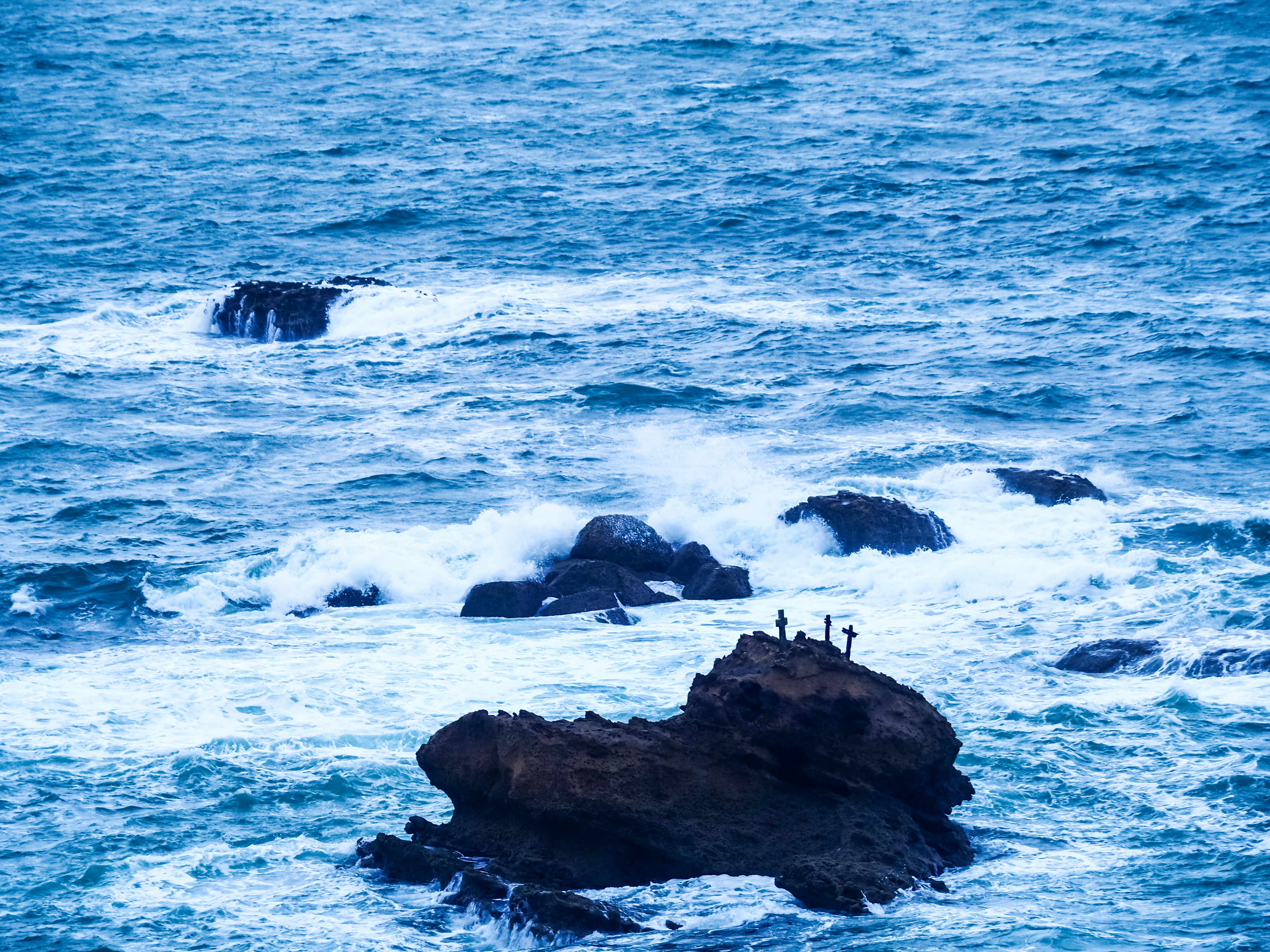Rock Outcrop Amid Blue Swell