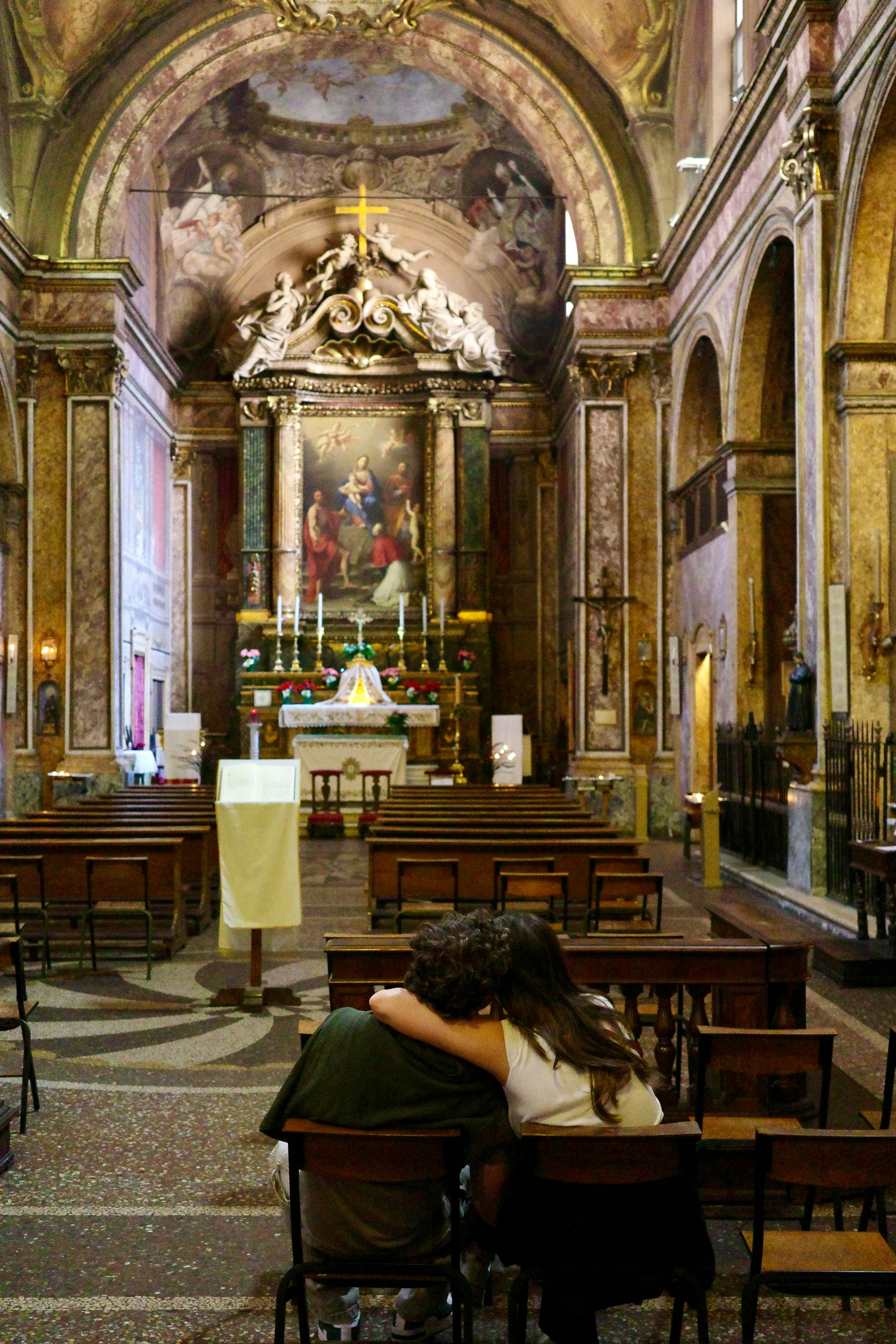 Embrace in the Cathedral: Lovers Rest at the Front Row