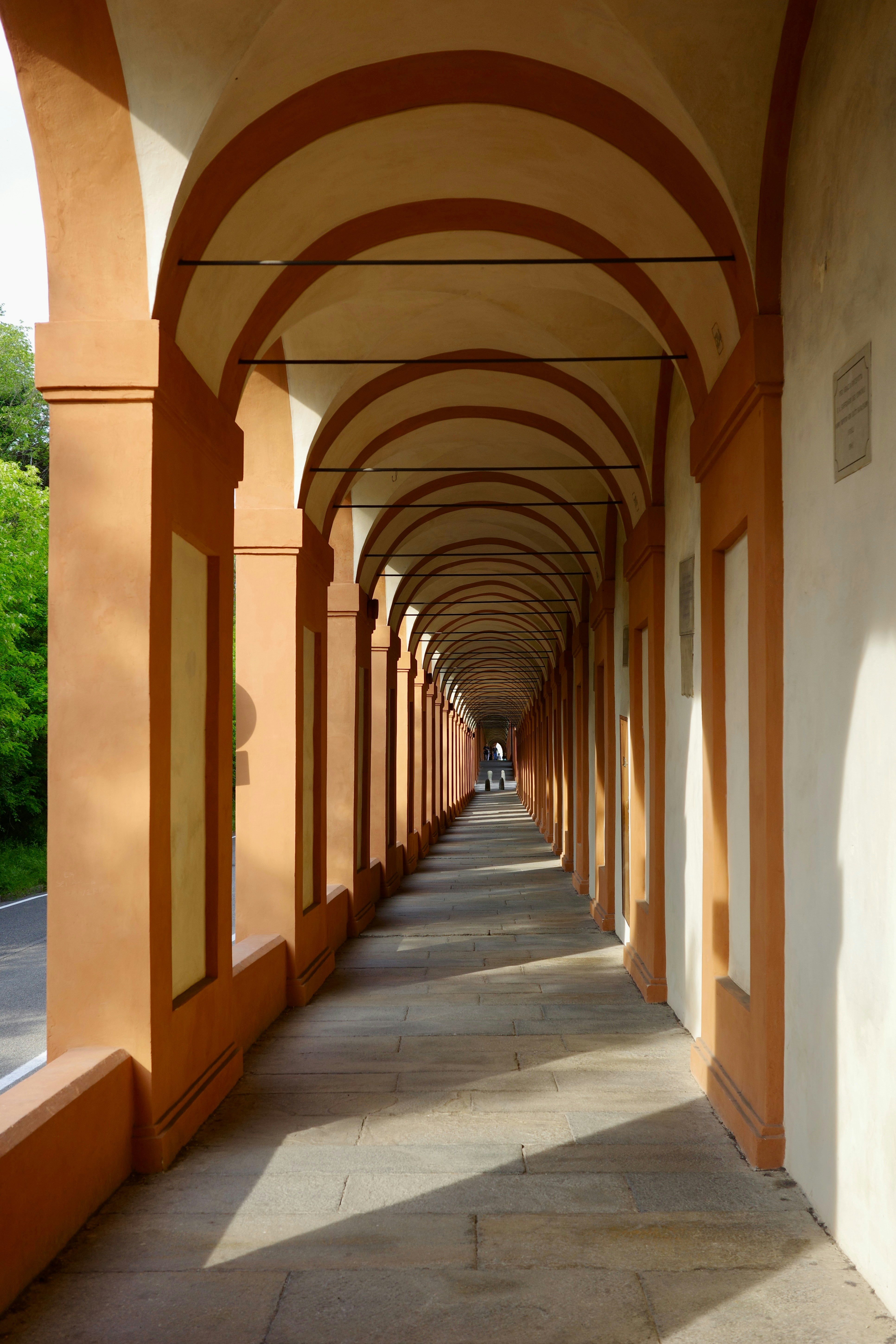 Archway Clock: A Vanishing Corridor of Light and Shadow