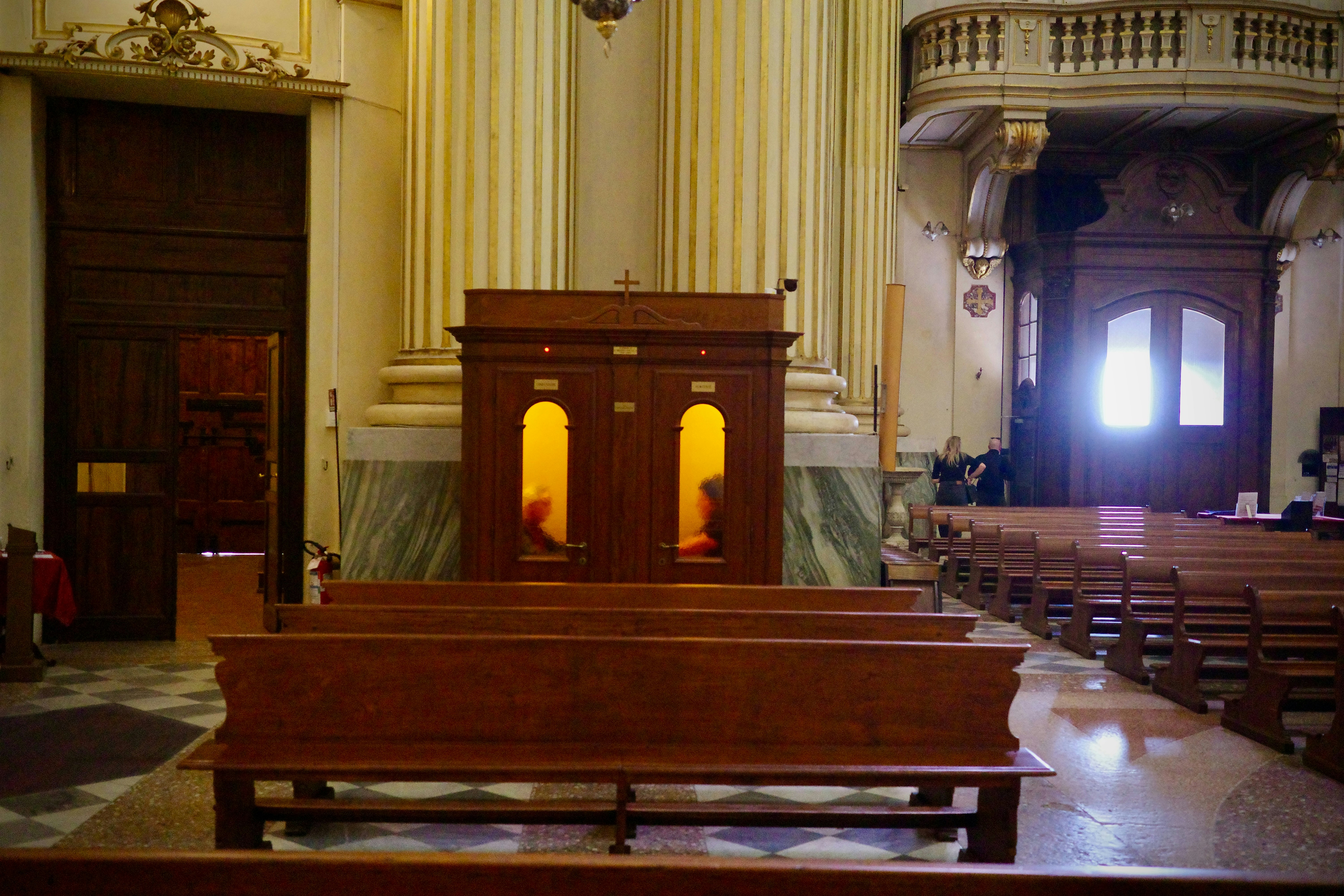 A Quiet Gable of Faith: Wooden pews and altarpiece in a sunlit chapel