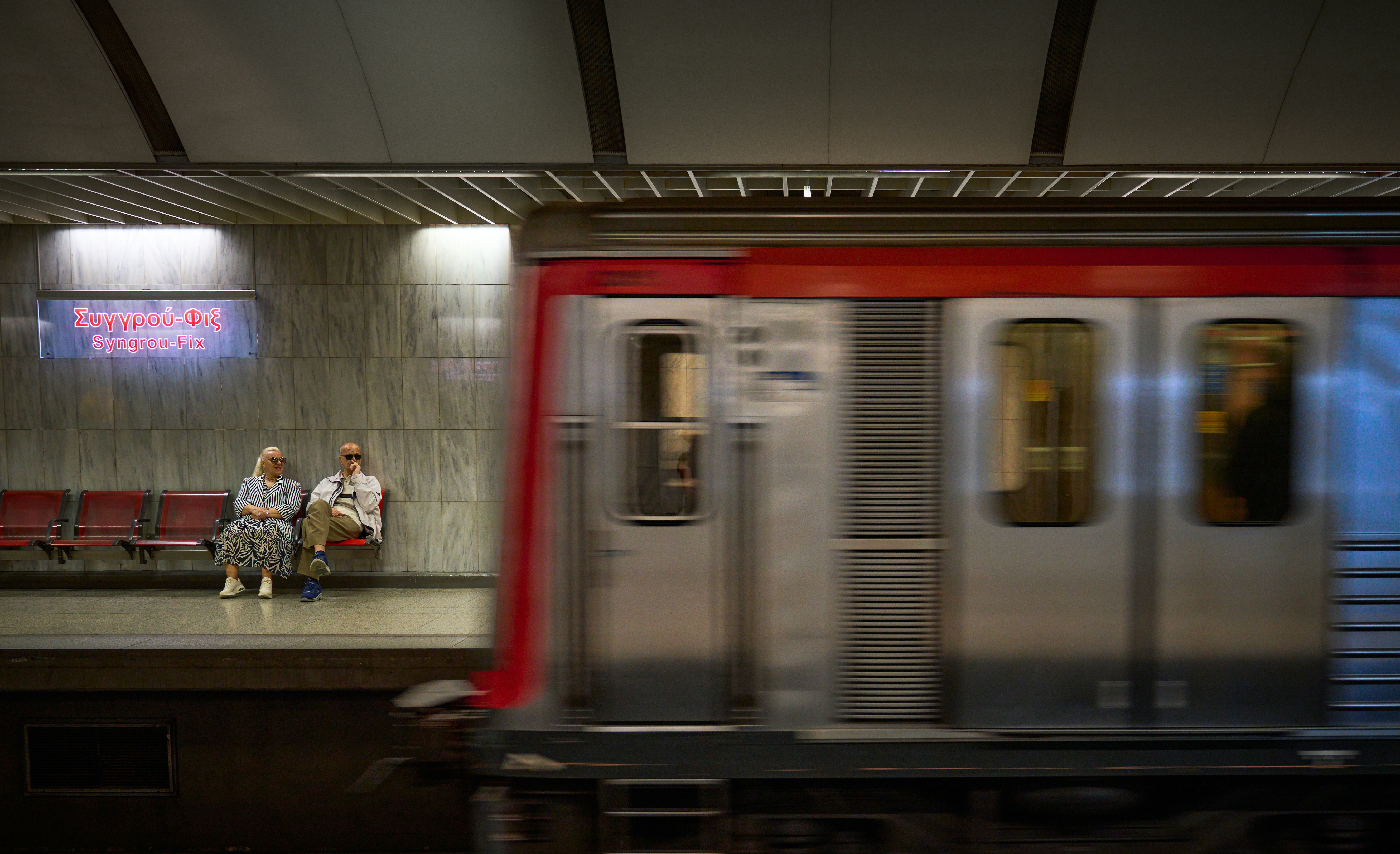 Motion at Platform A: Blurred Train Carries the Quiet Night Anonymities