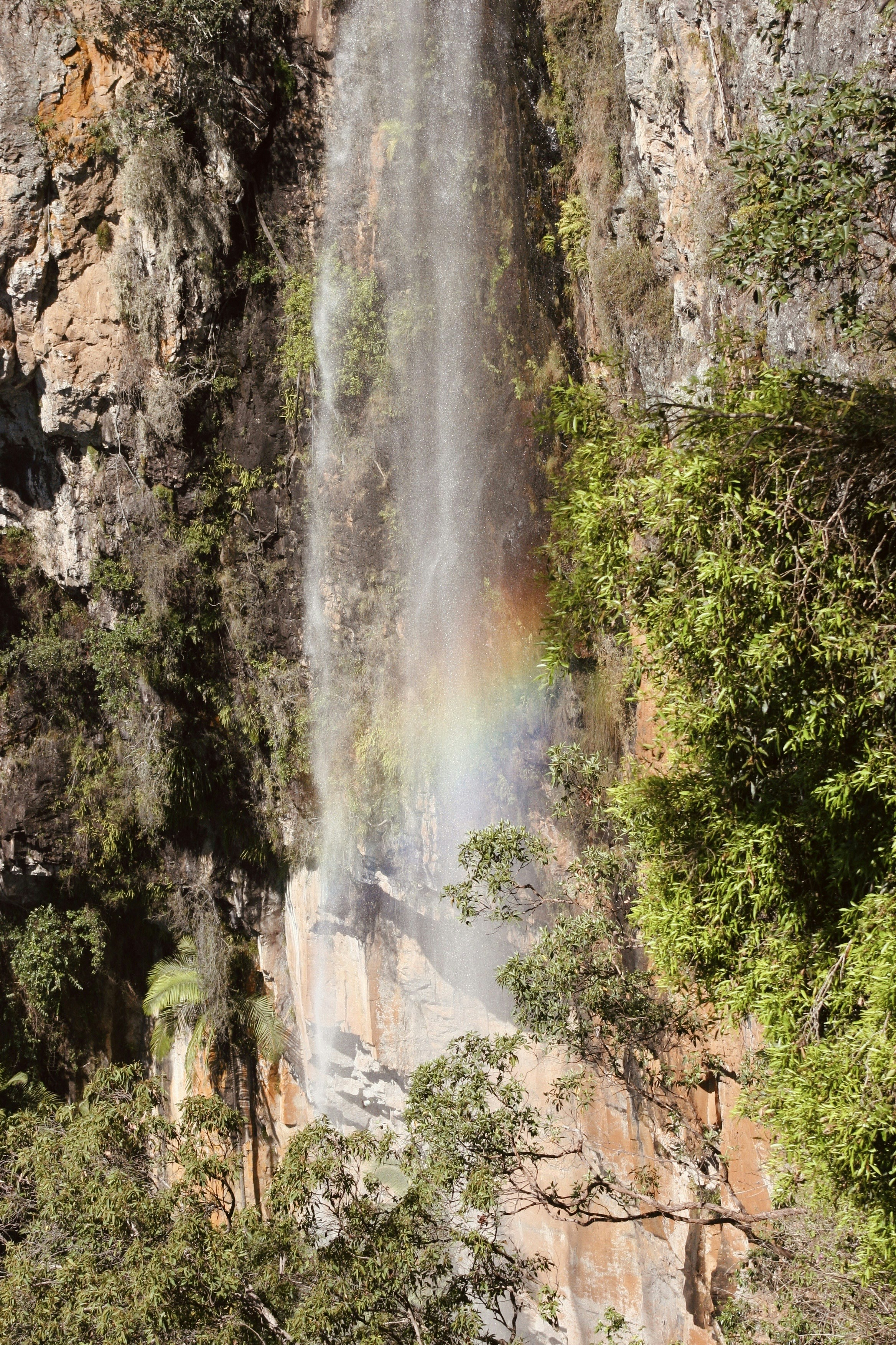 Rainbow Veil over a Rocky Cascade