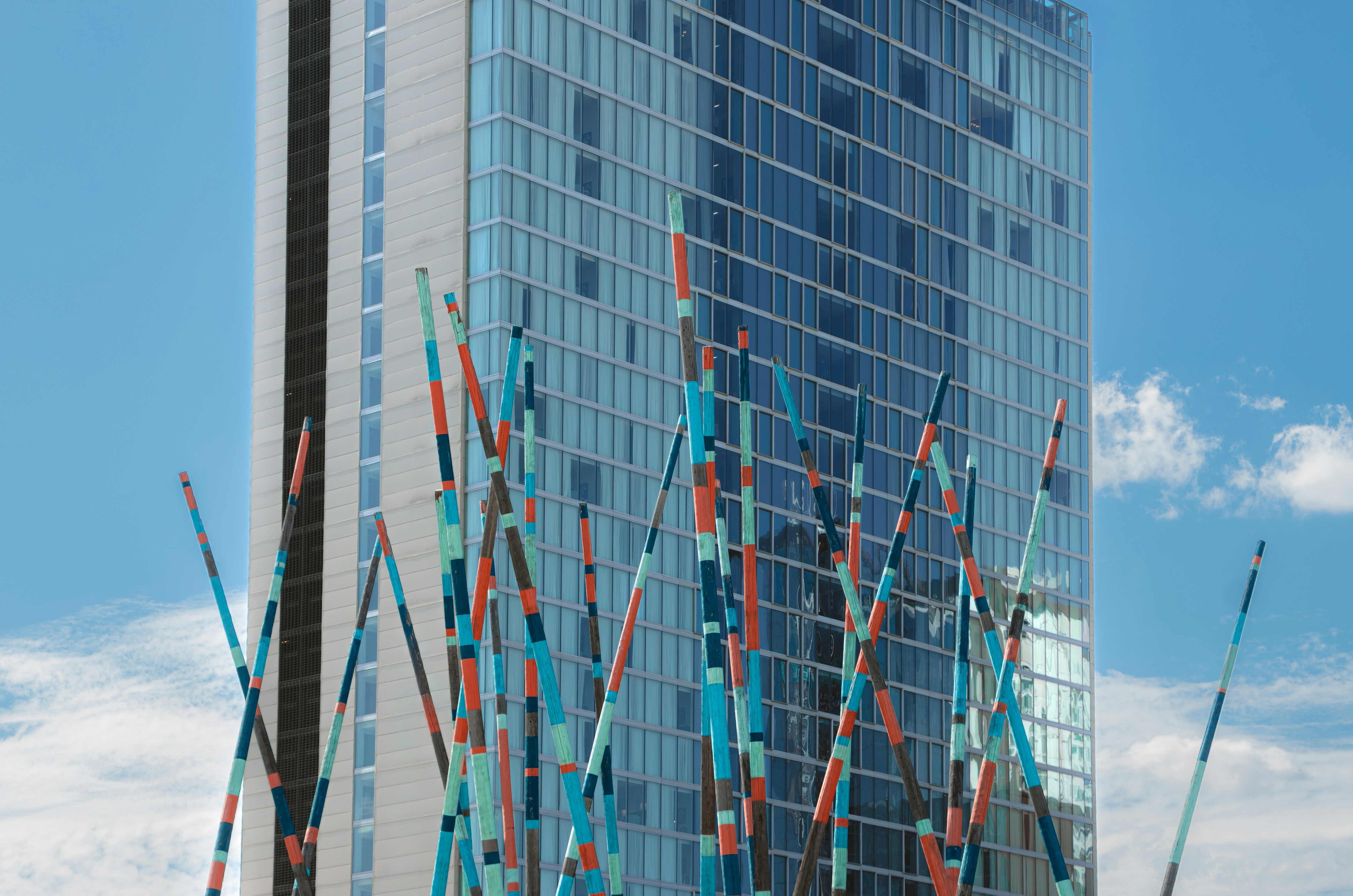 Chromatic Rods Ascend Against a Glassy Tower
