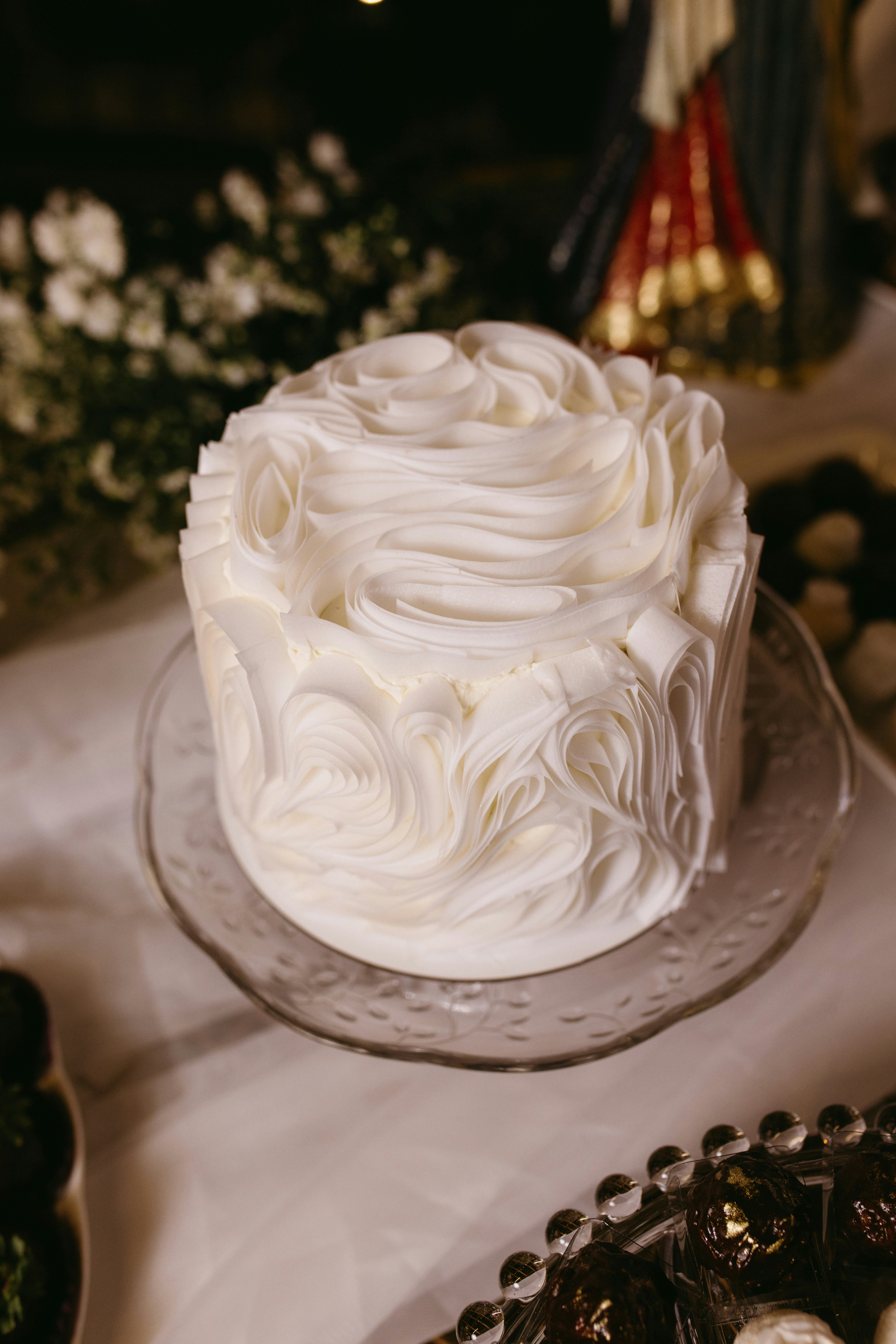 Elegant Whispers: A Frosted Cake Centered in Soft Candlelight