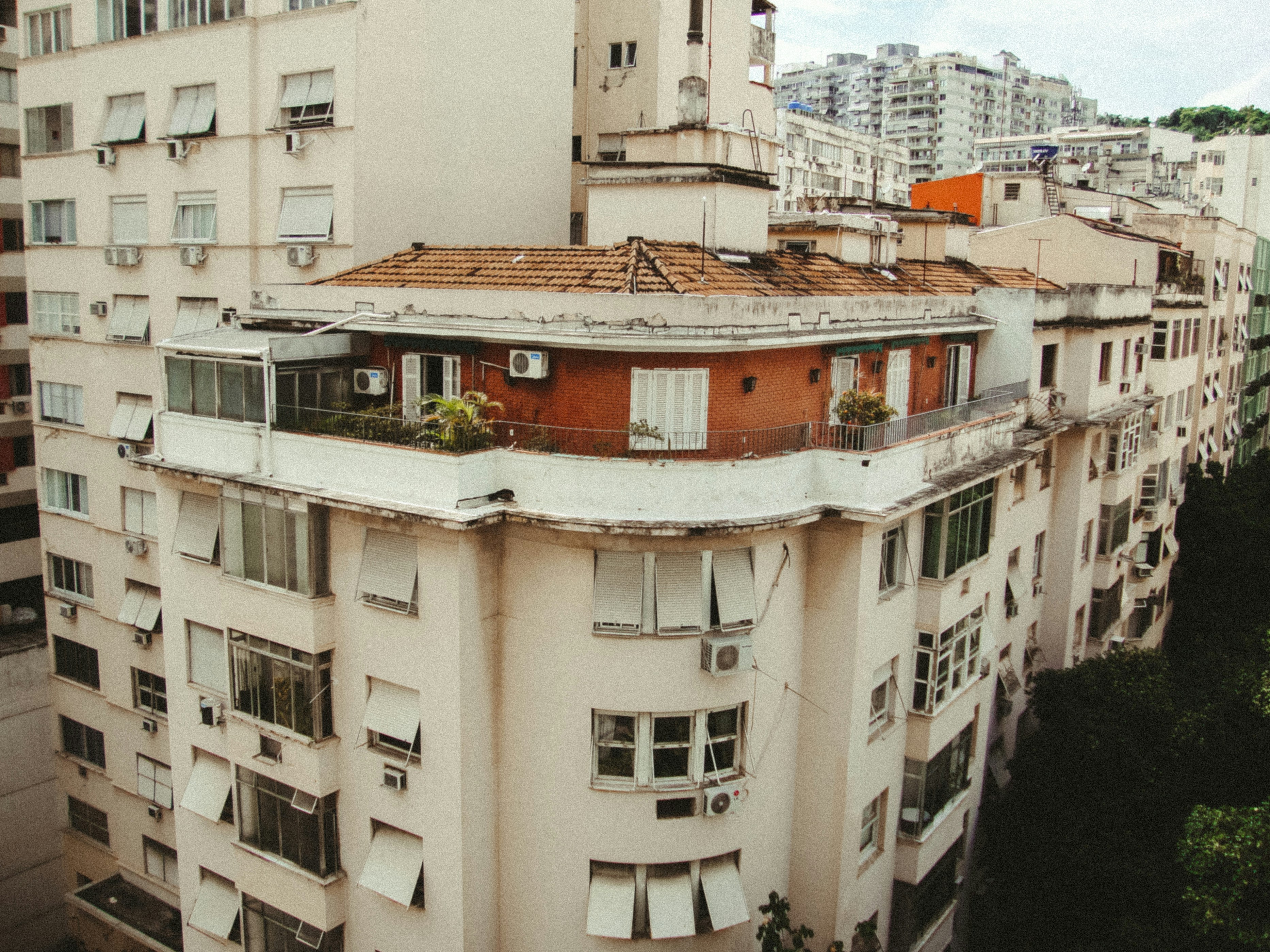 Terraced Urban Facade: A Weathered Corner Line of Apartments