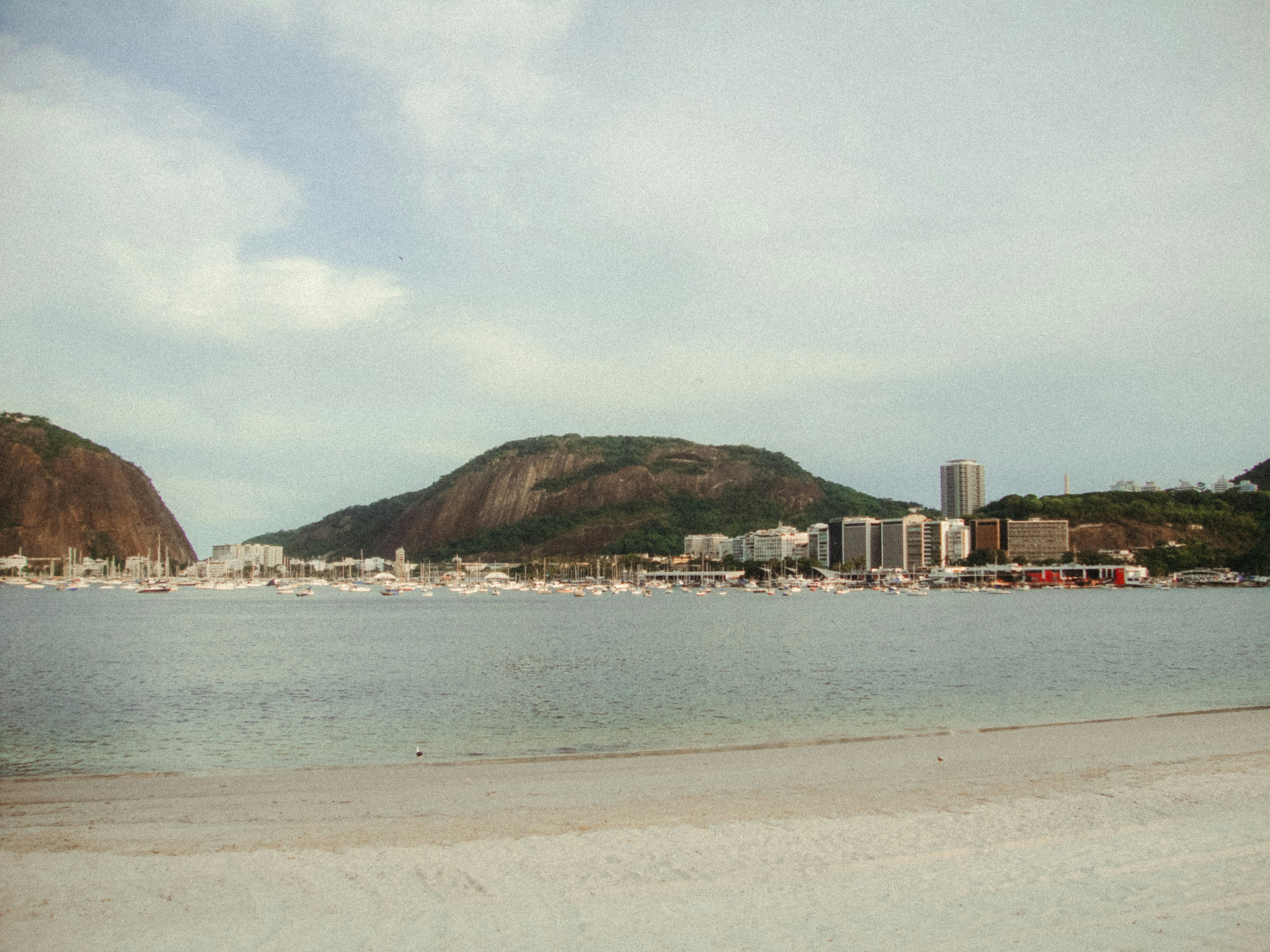 Coastal Cityscape Across Quiet Bay at Beach