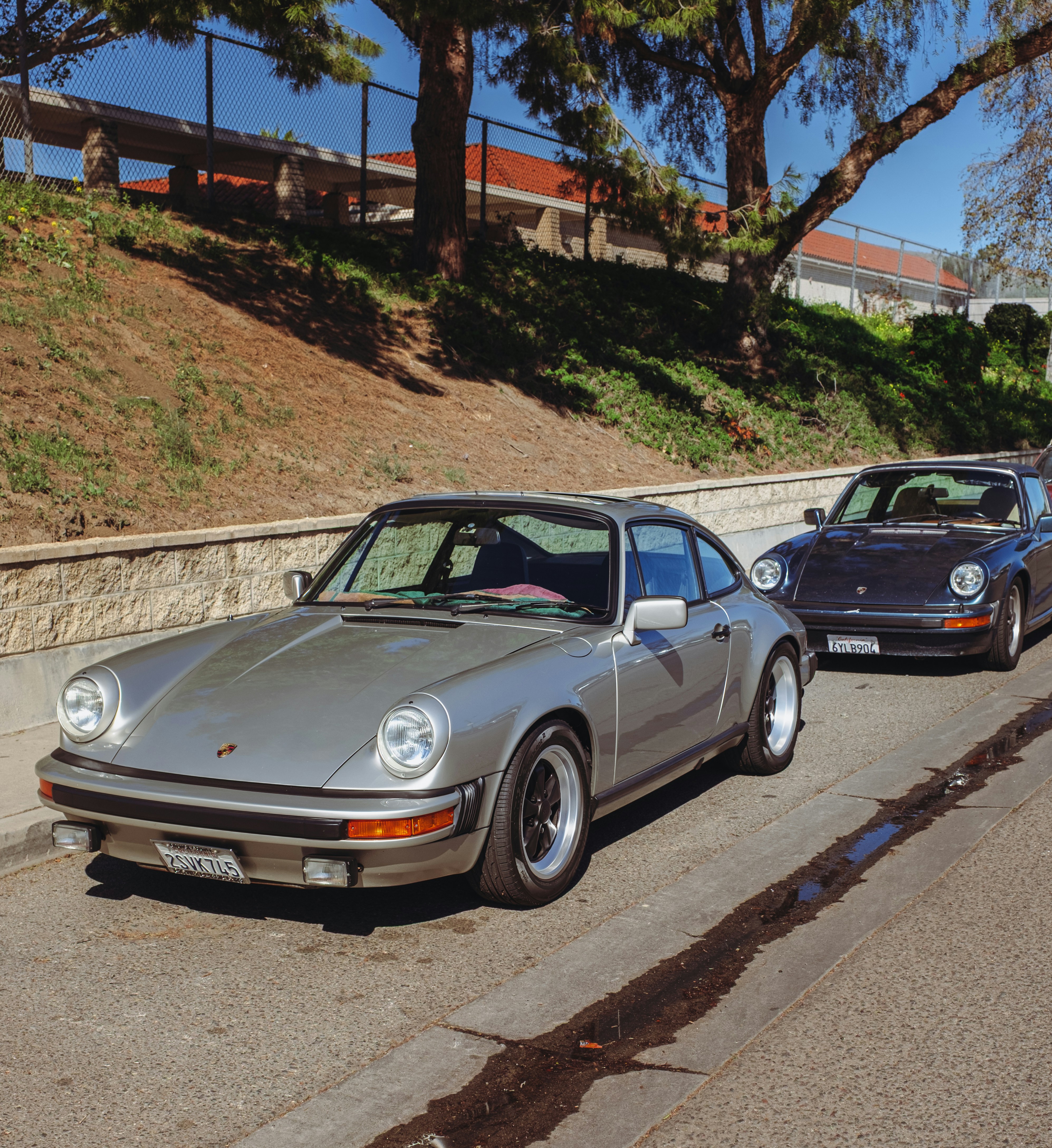 Silver Porsche 911 Leads a Quiet Street Parade