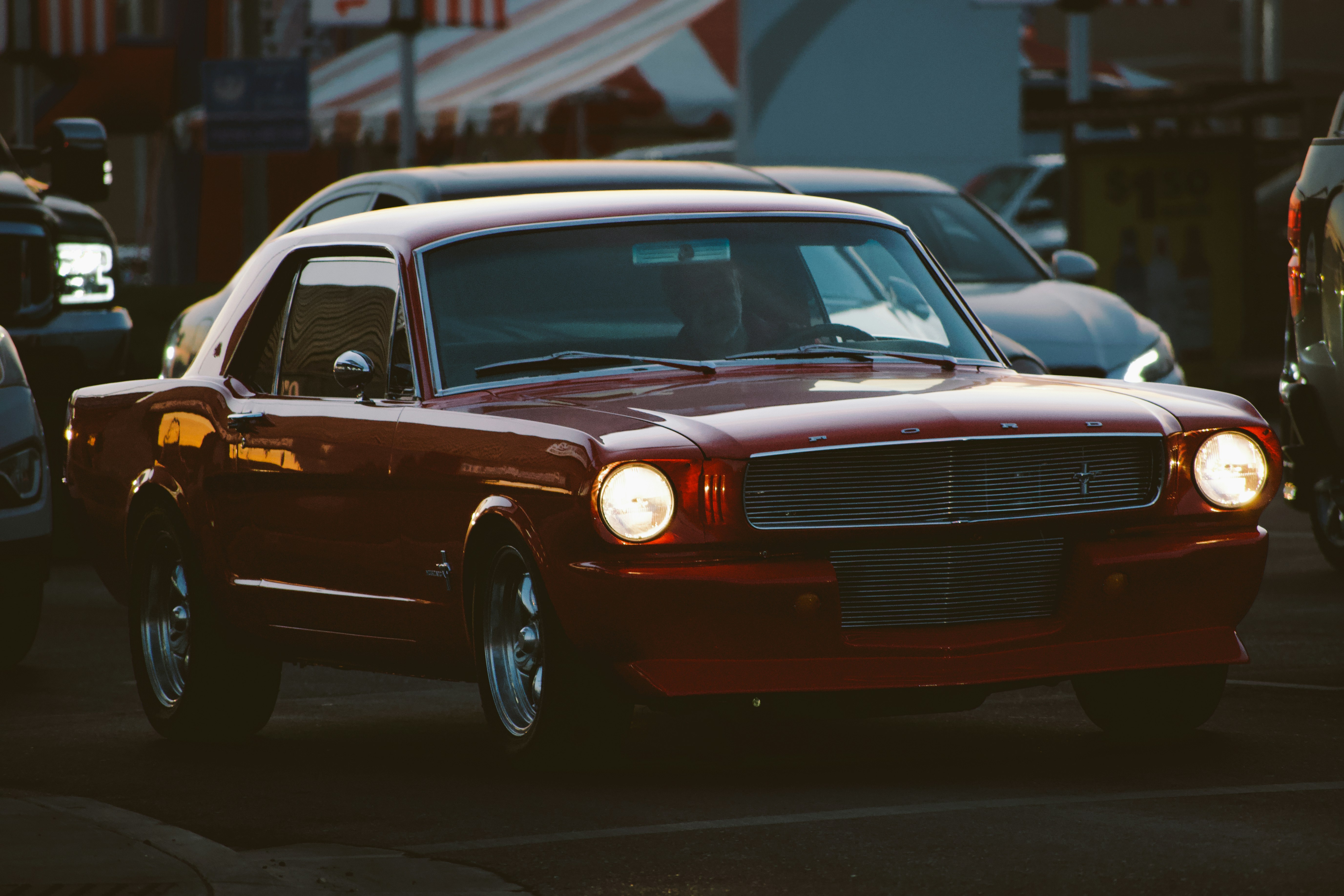 A Crimson Classic Rides Through Evening Dusk