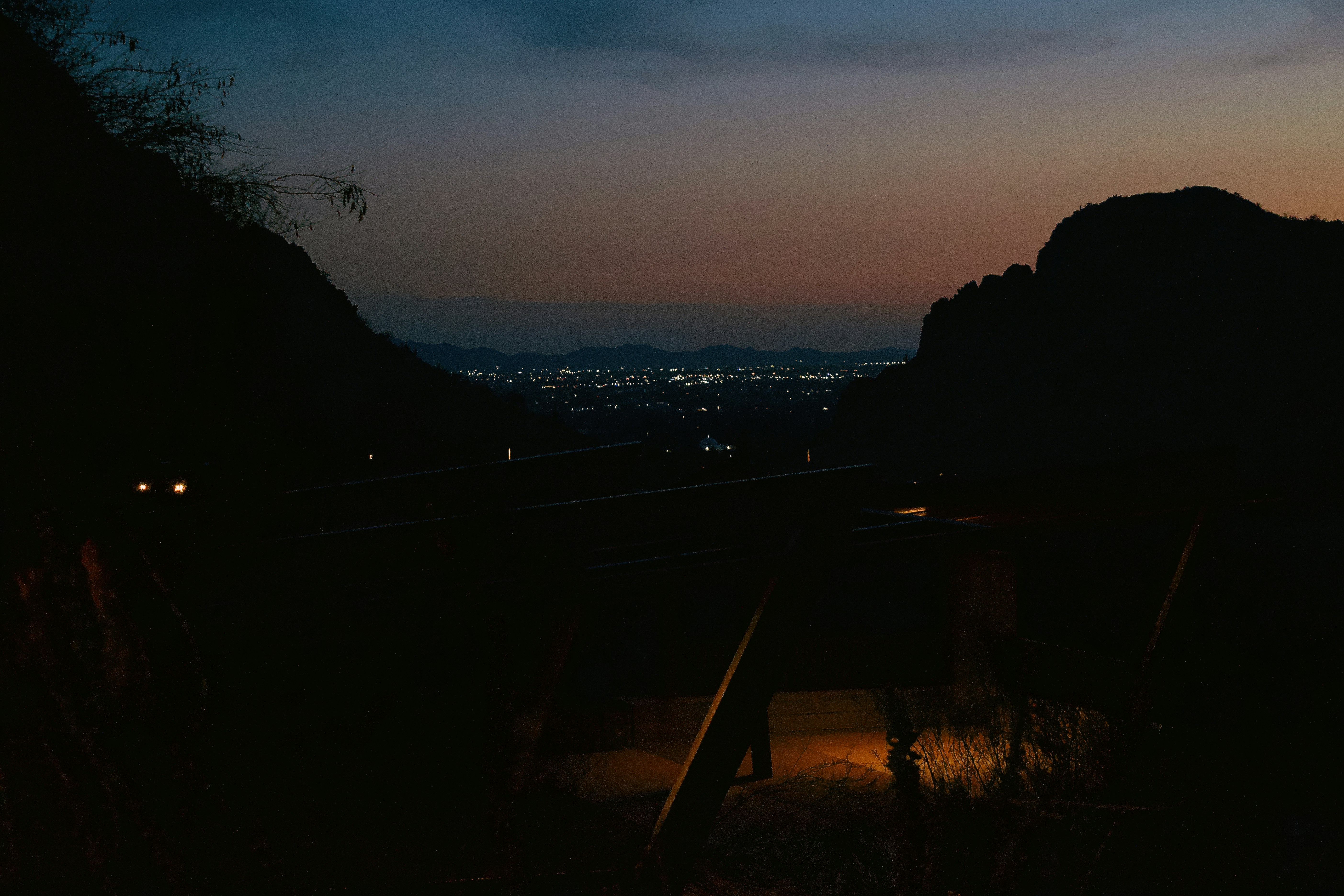 Distant City Glow Beyond the Hills at Dusk