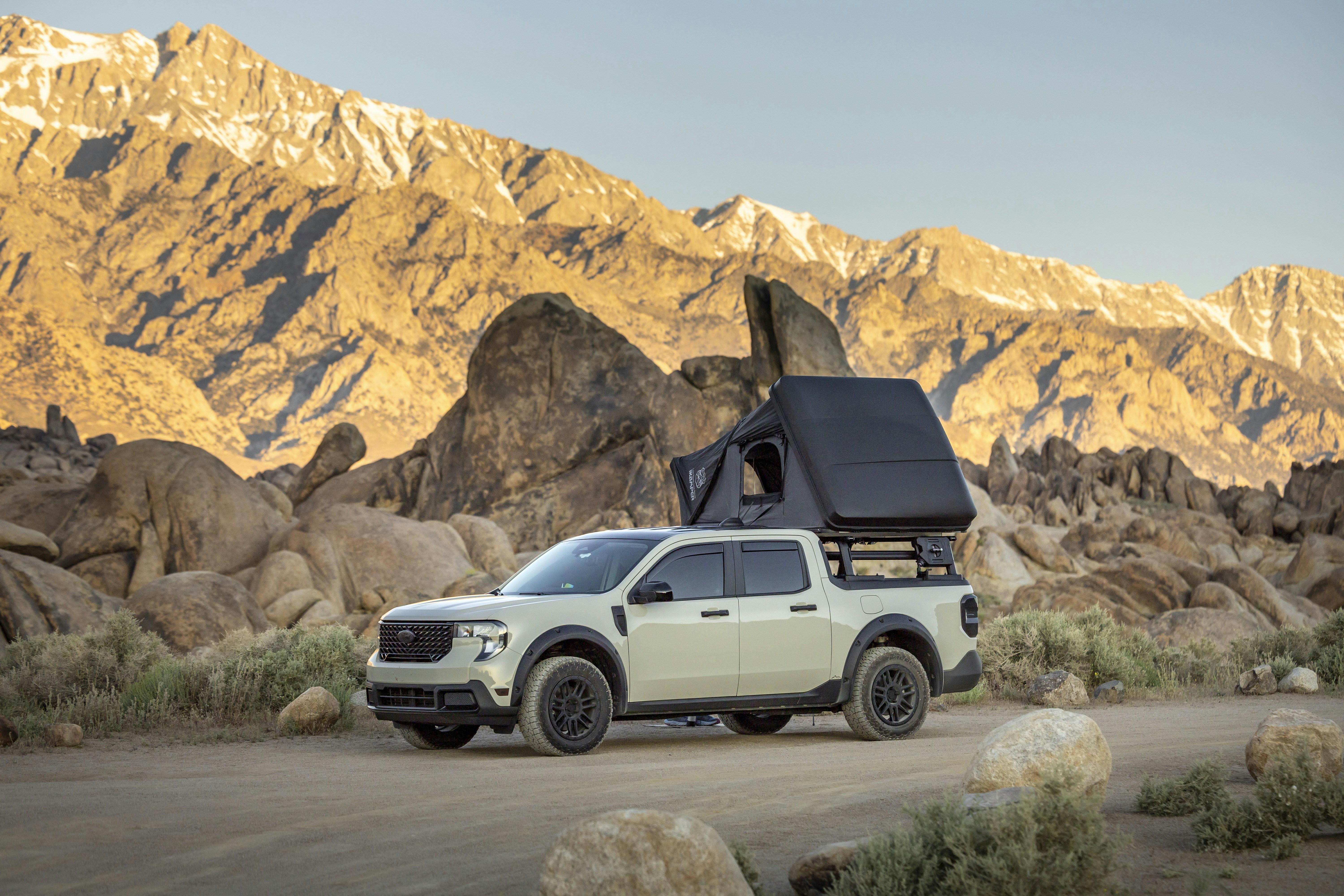 Adventure Ready: The White Pickup with a Rooftop Trekket in Desert Foothills