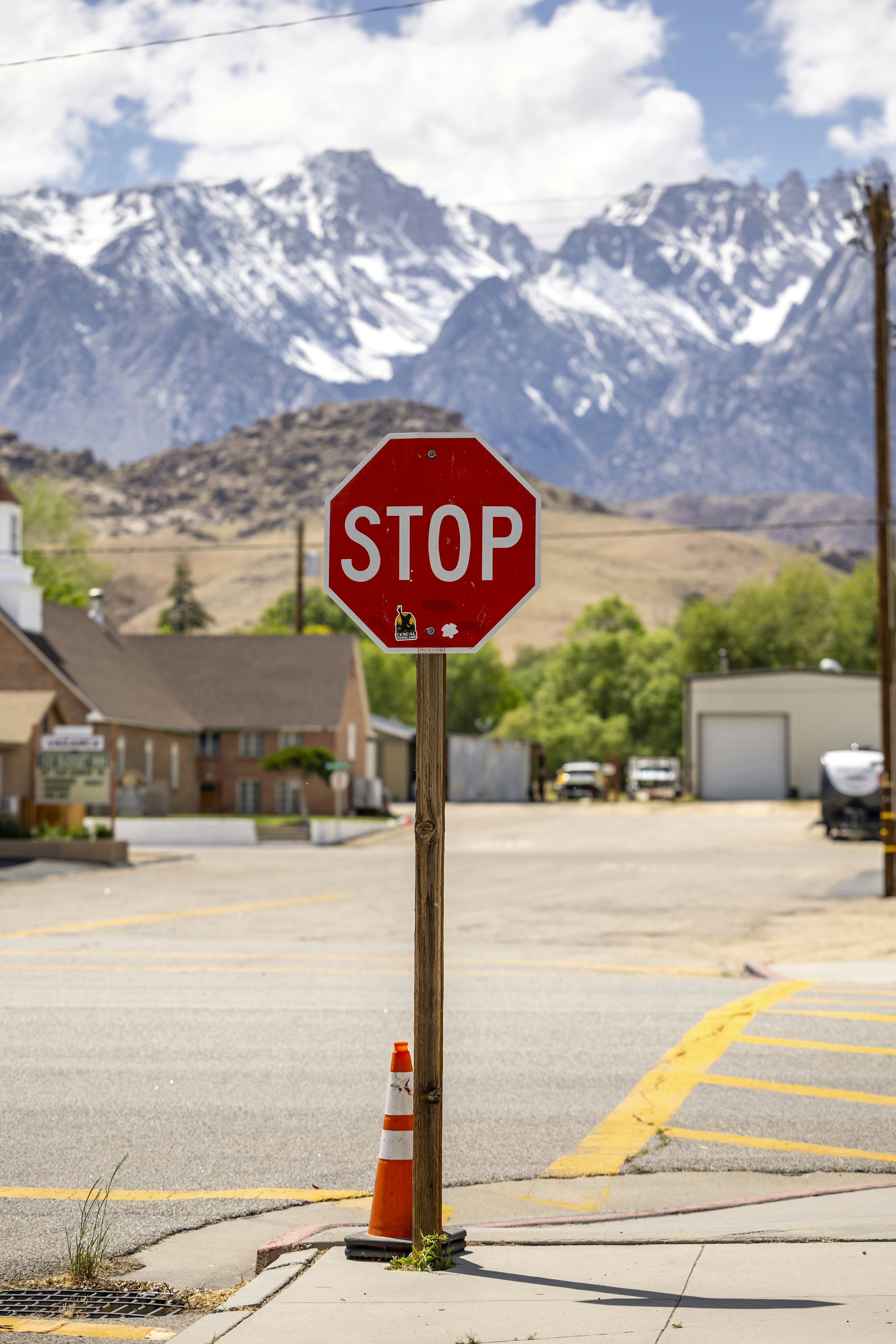 Snowy Peaks Over a Quiet Stop Sign