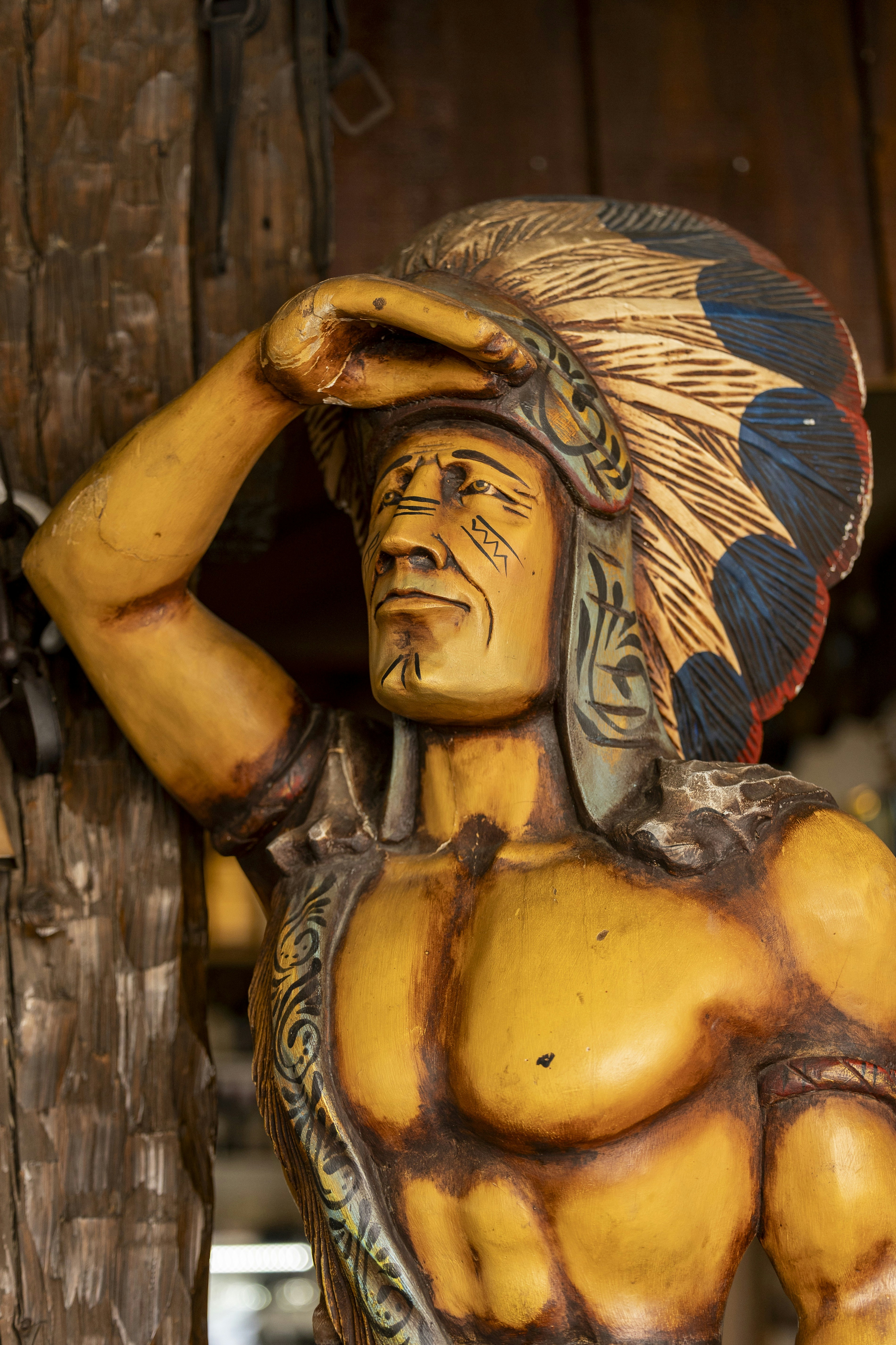 Sunlit Native Chief Statue Reaching Toward the Horizon