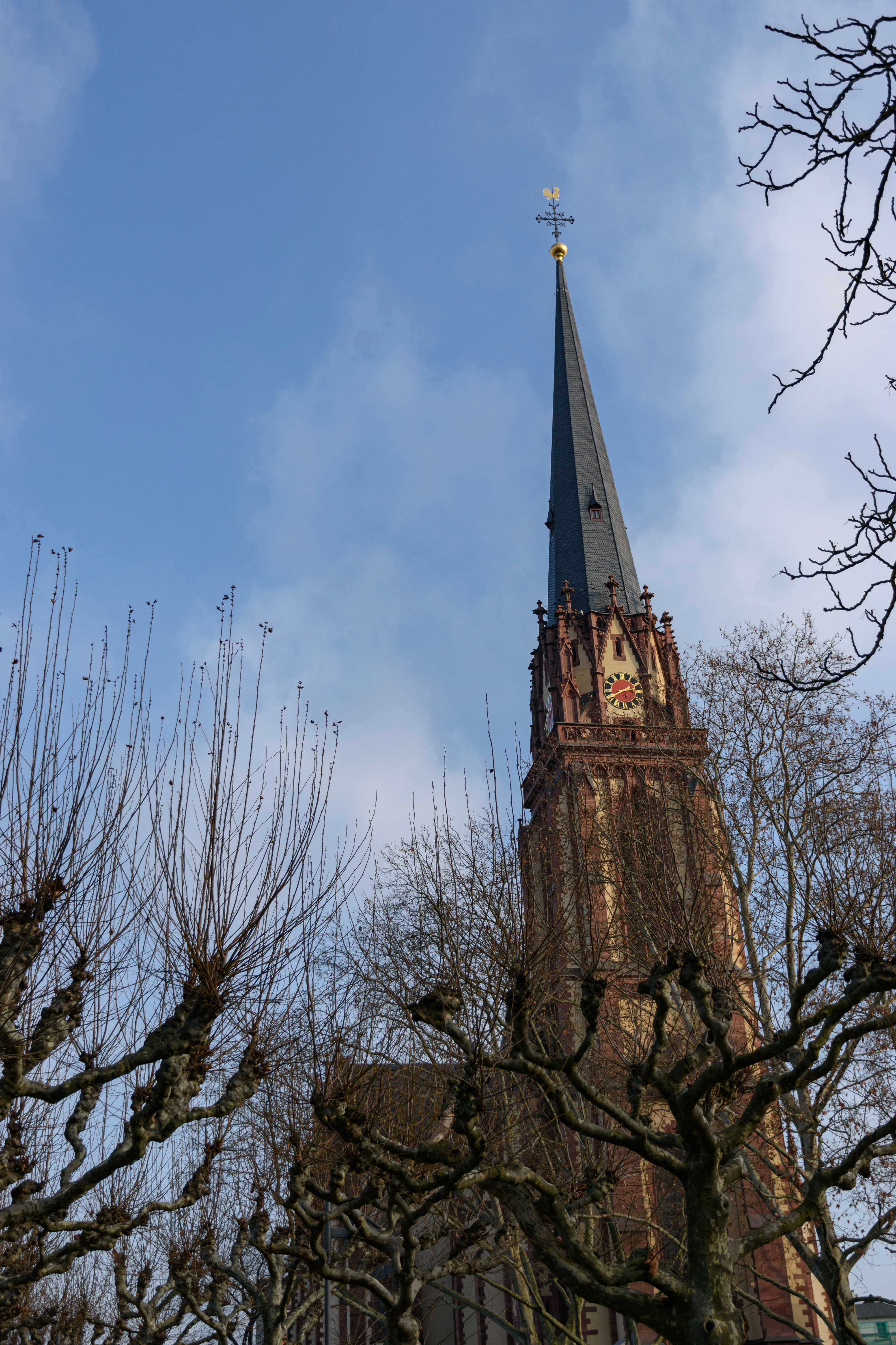 Spire against the North Sky: A Church Tower Reaching Toward Spring