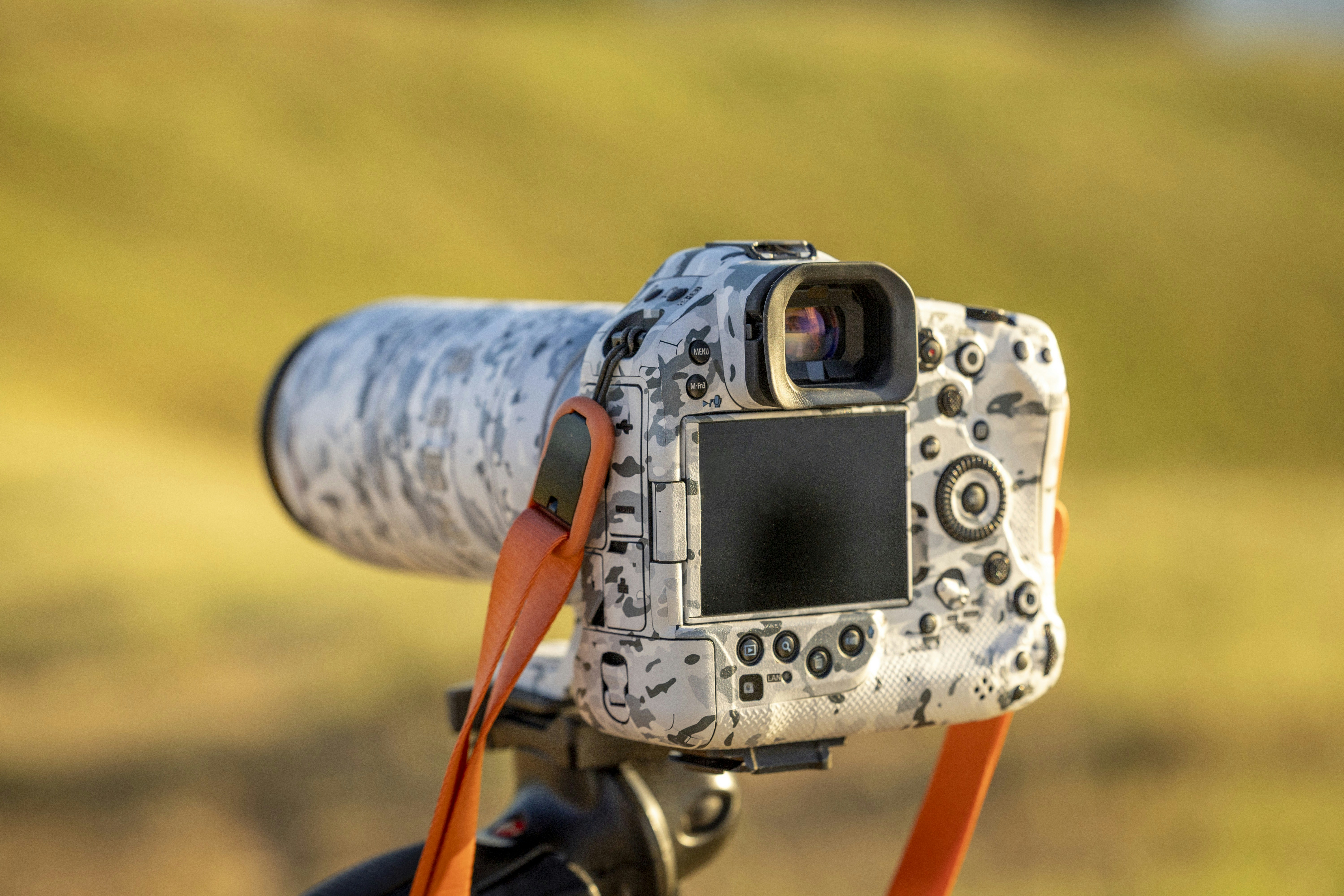 Camouflage Telephoto: A Retro-Lleptic Lens on a Camouflaged Prism
