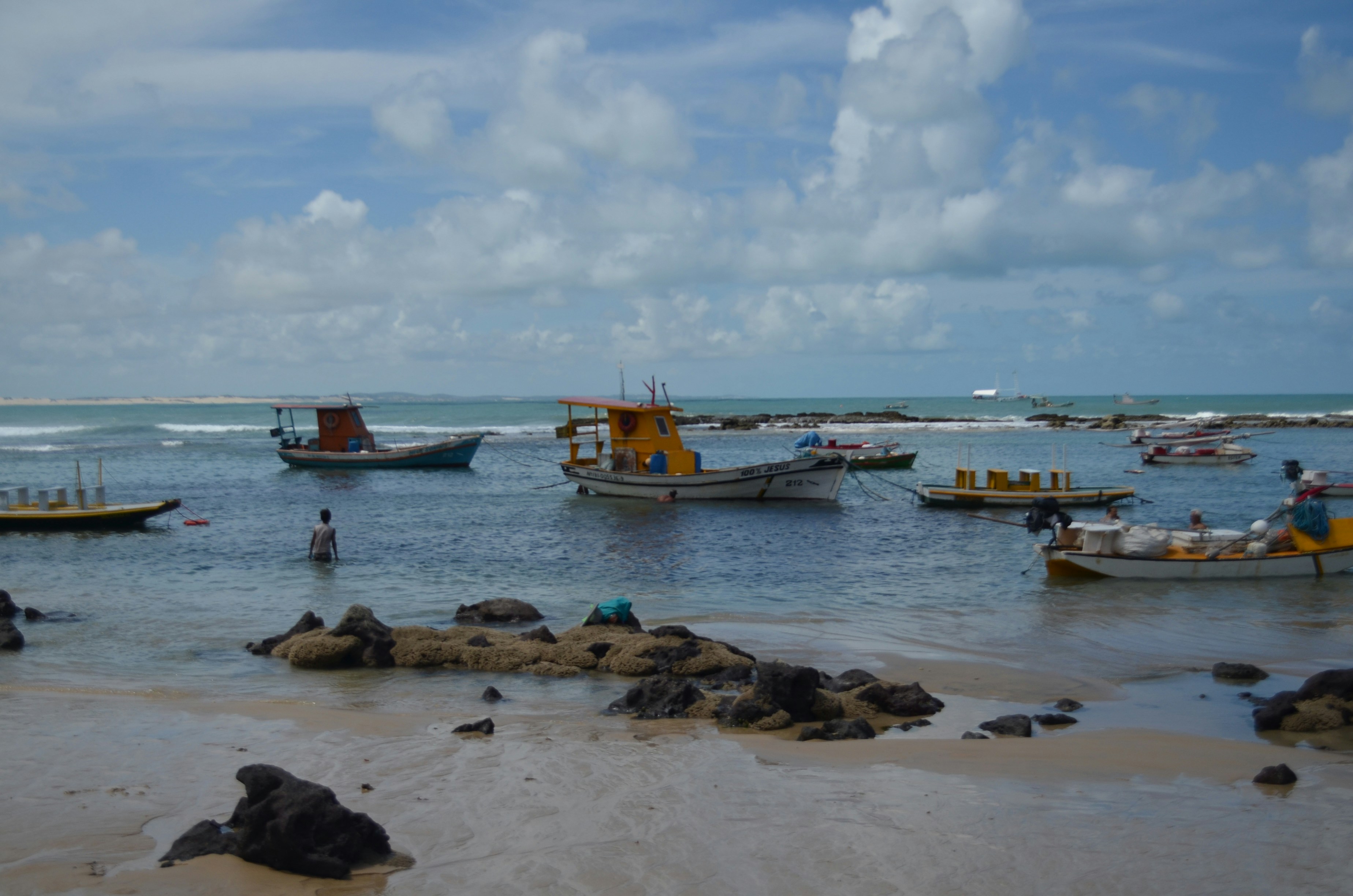 Sunlit Boats at a Quiet Coral Coast
