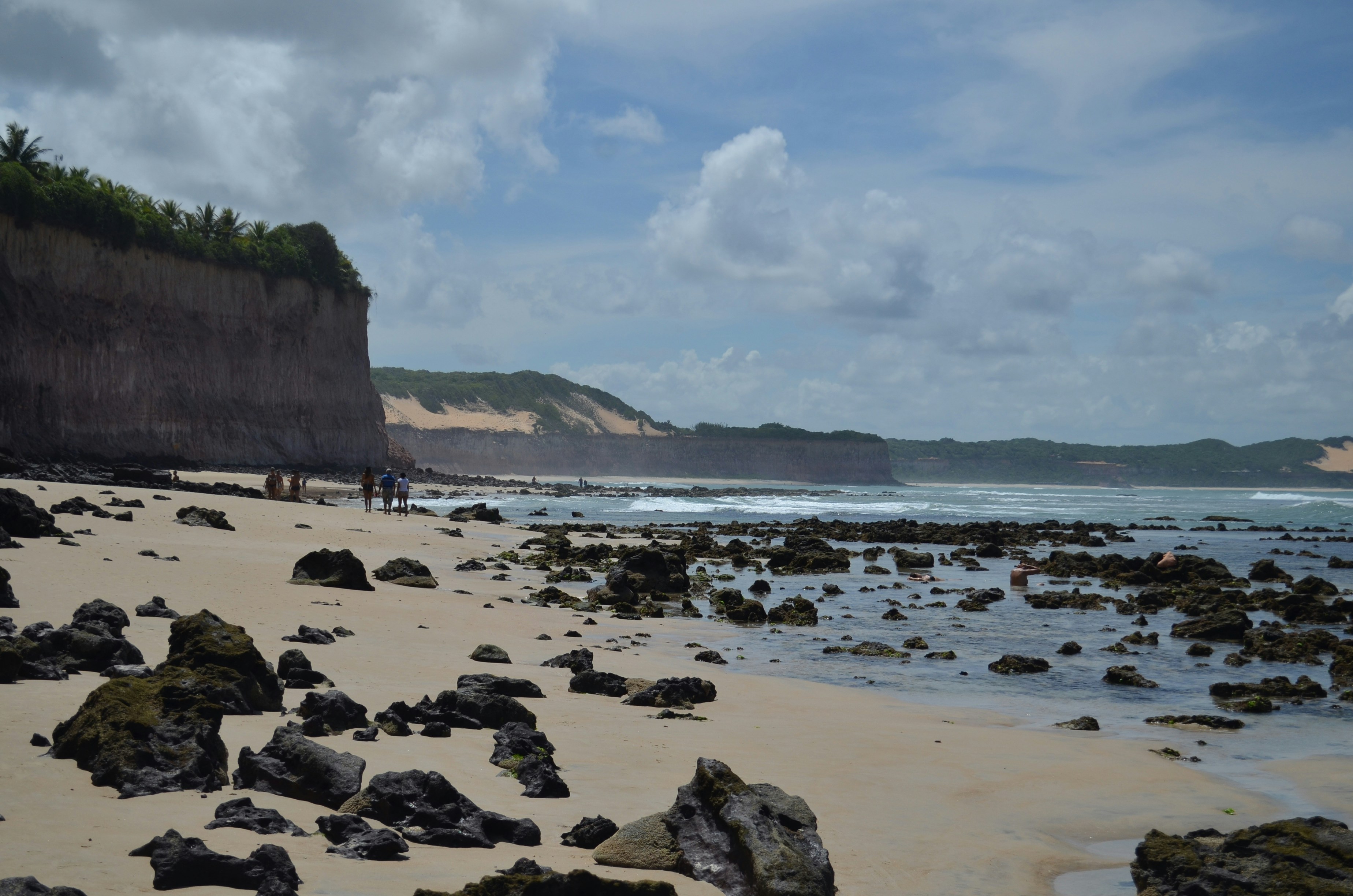 Cliffside Beach at Dusk: A Quiet Shoreline with Rugged Rocks
