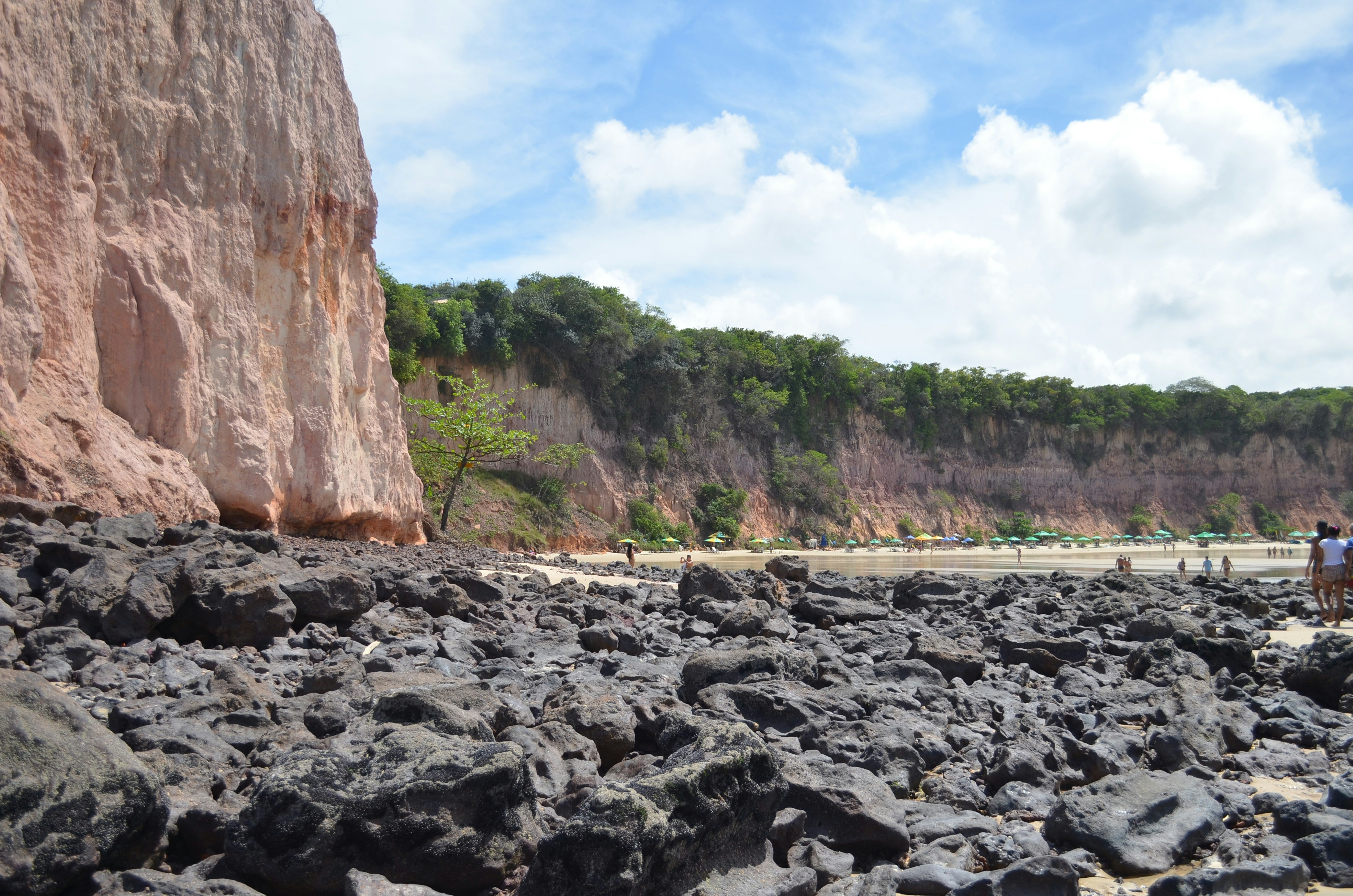 Cliffside Shoreline Under Cottony Skies