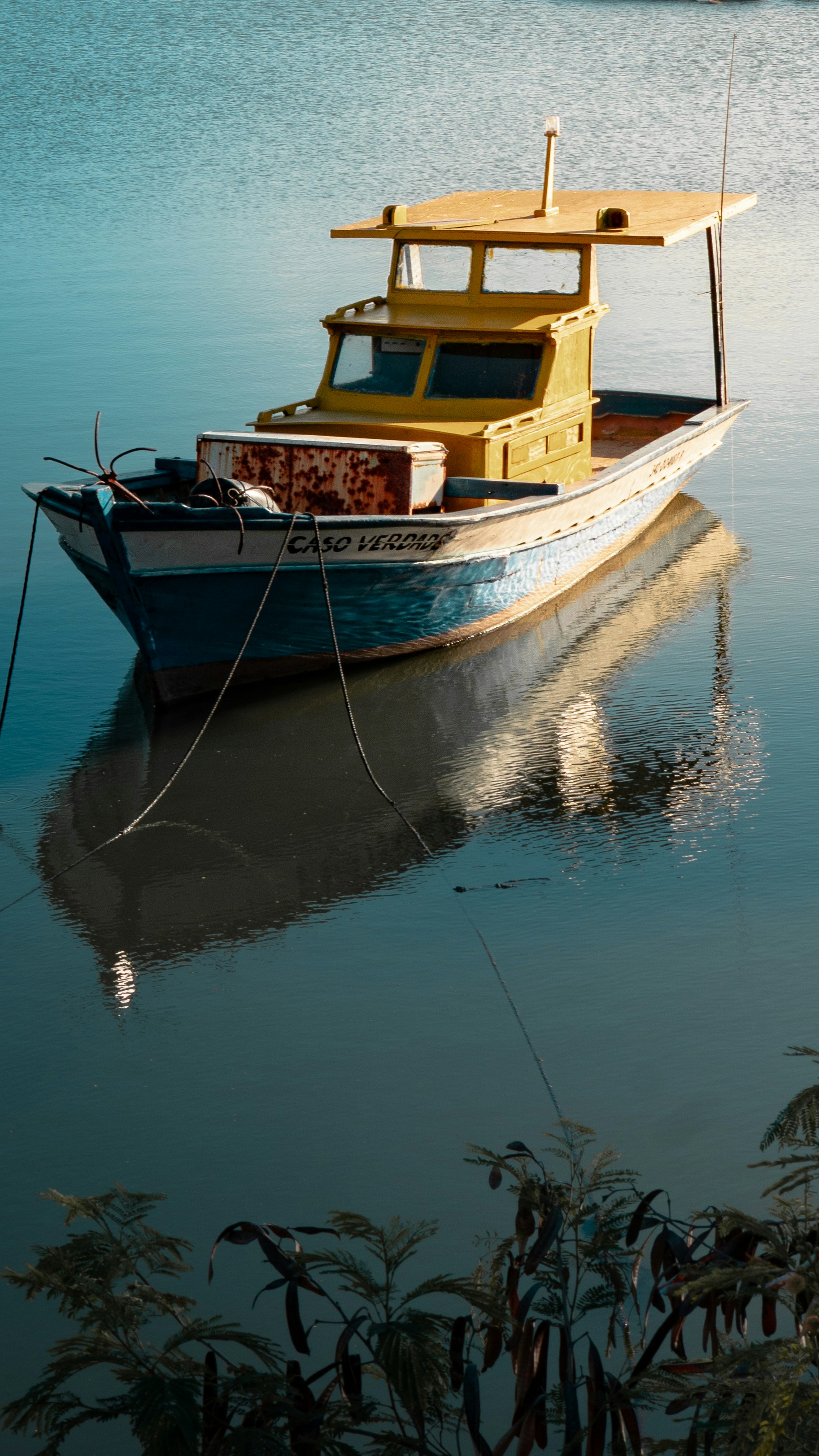 Weathered Fishing Vessel Anchored in a Calm Lagoon