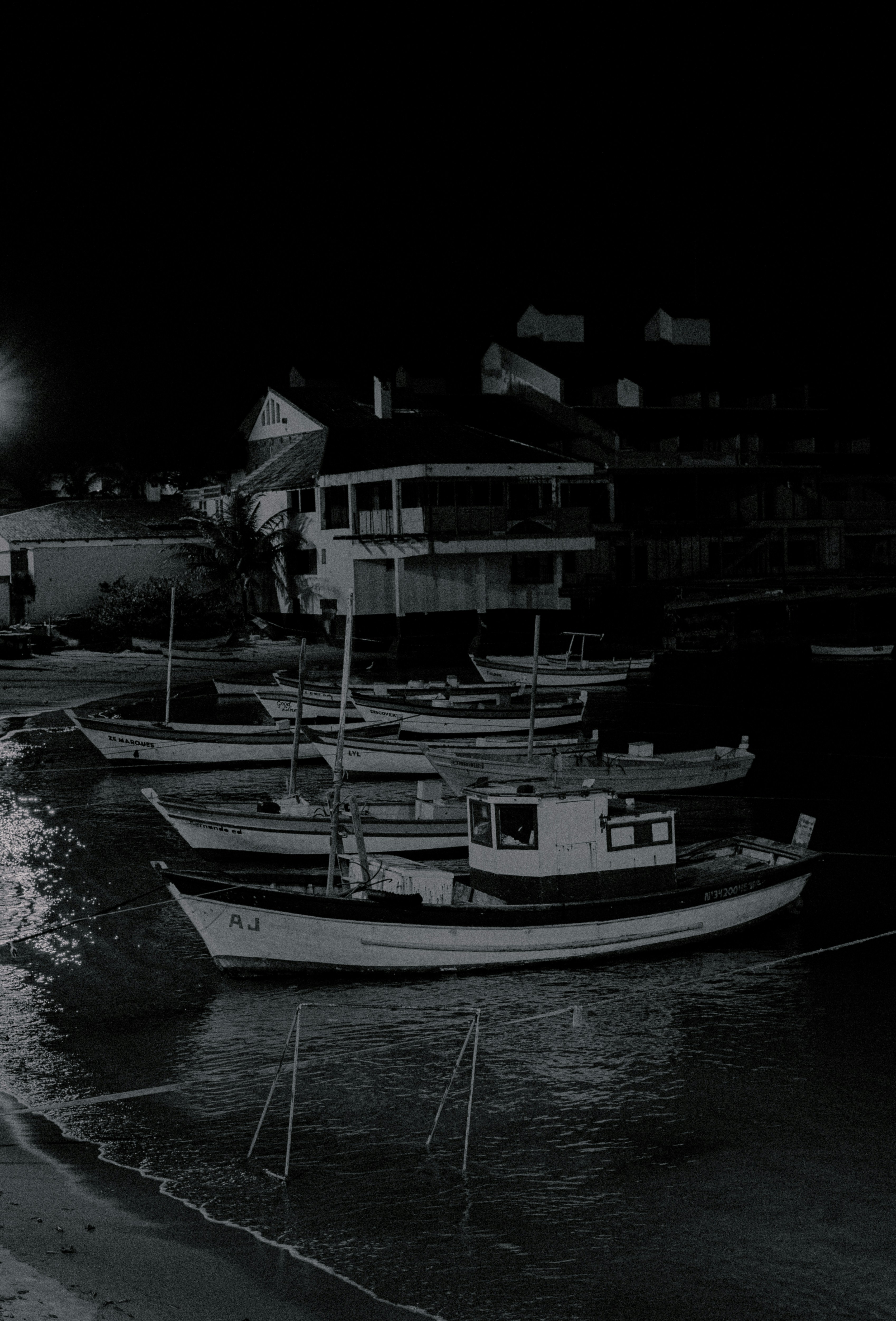 Moonlit Marina: Boats Quietly Rest in the Void