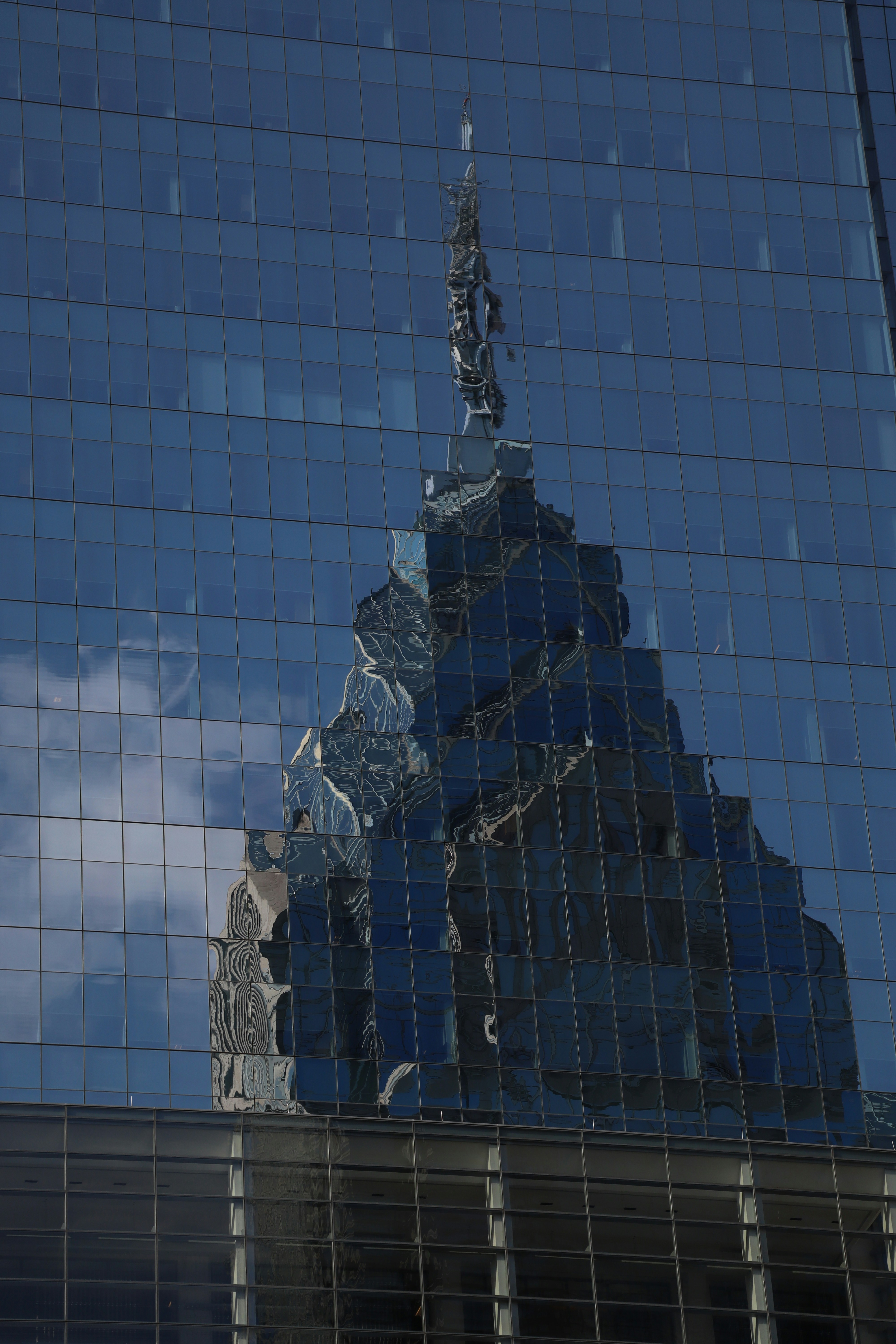 Crown of Glass: Reflection of a Skyscraper Peak