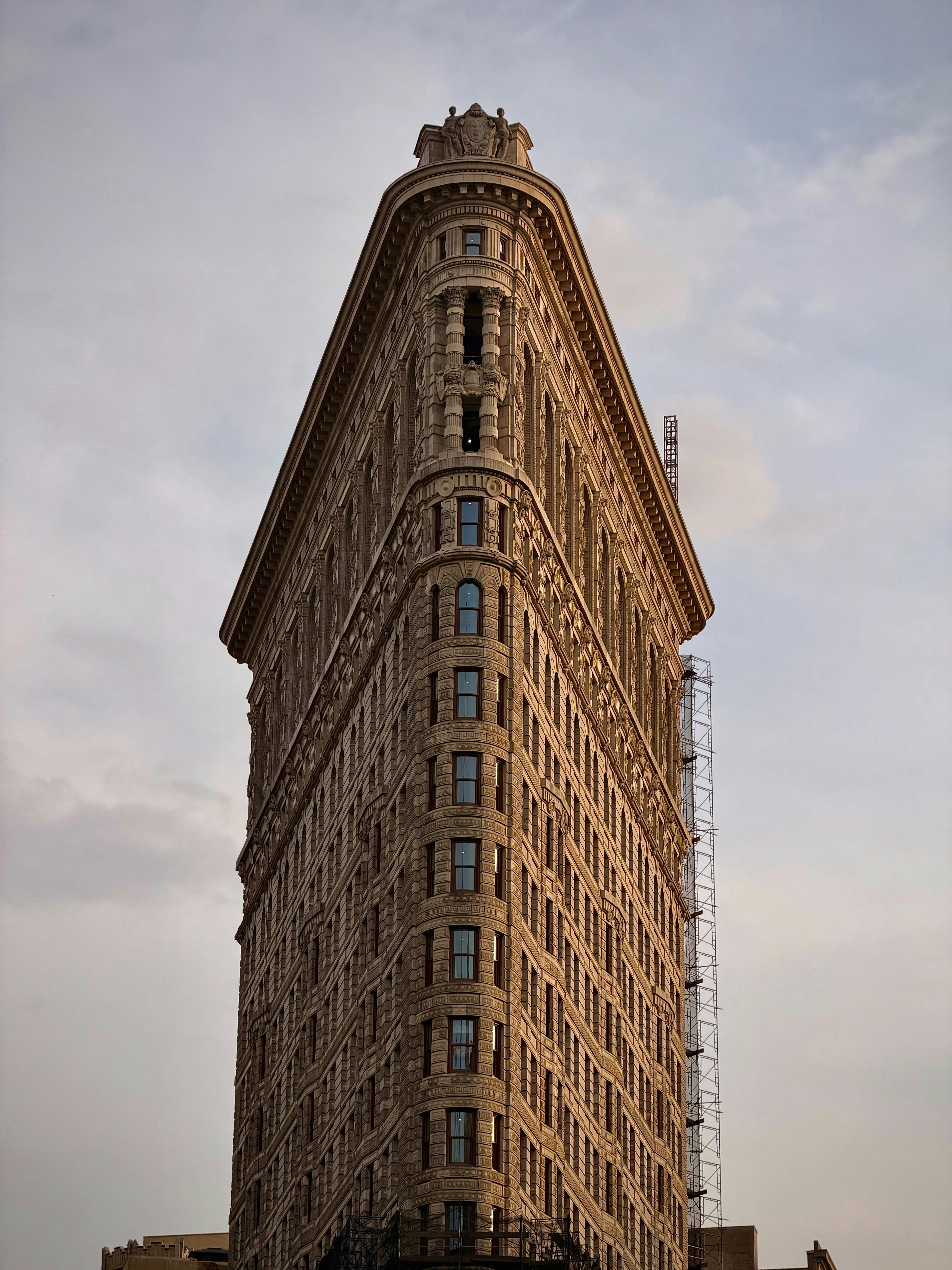 The Flatiron’s Quiet Gaze: A Brick Obelisk Against the Sky