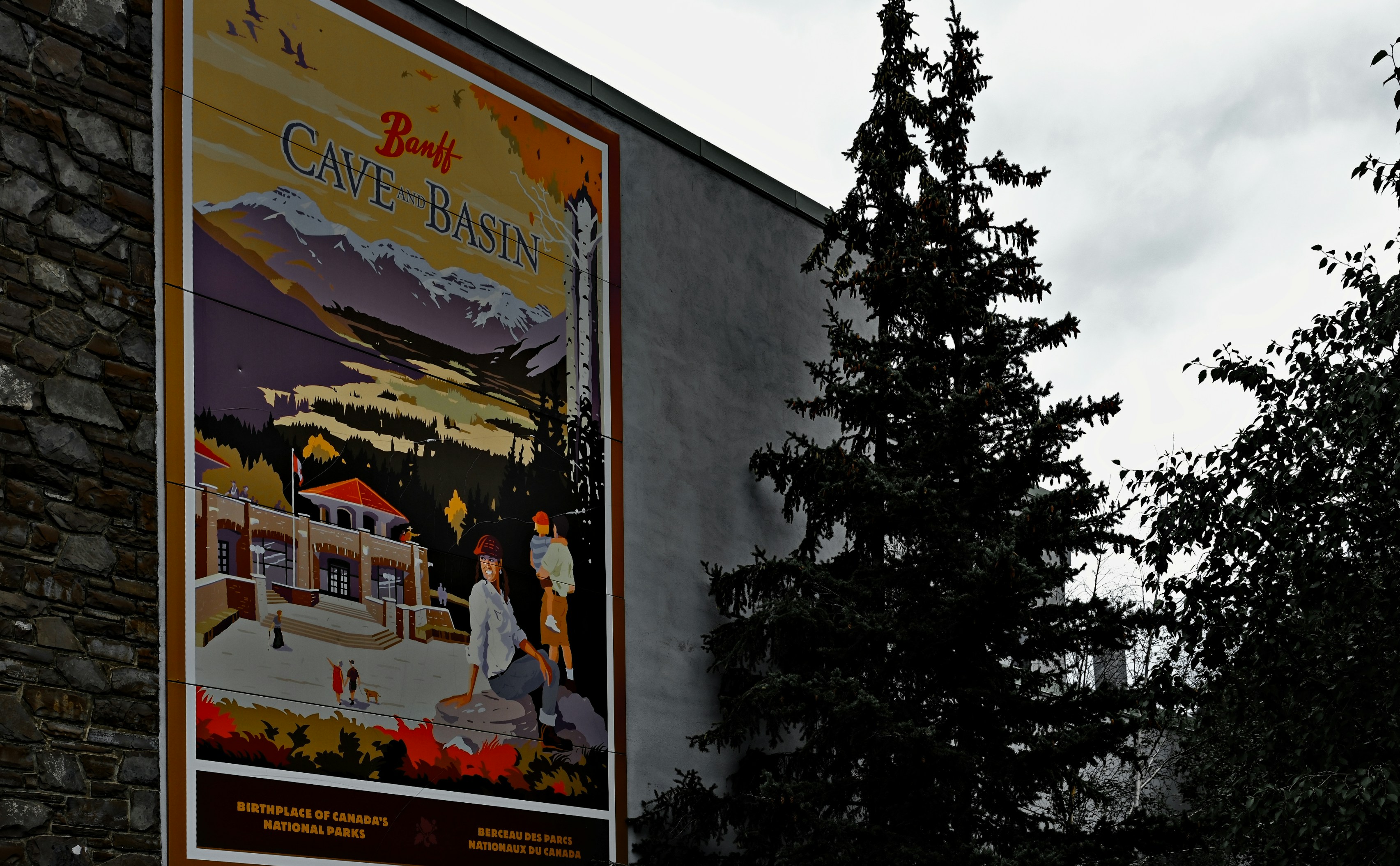 Poster Break: A Vintage Mountaintop Scene Framed by Pines