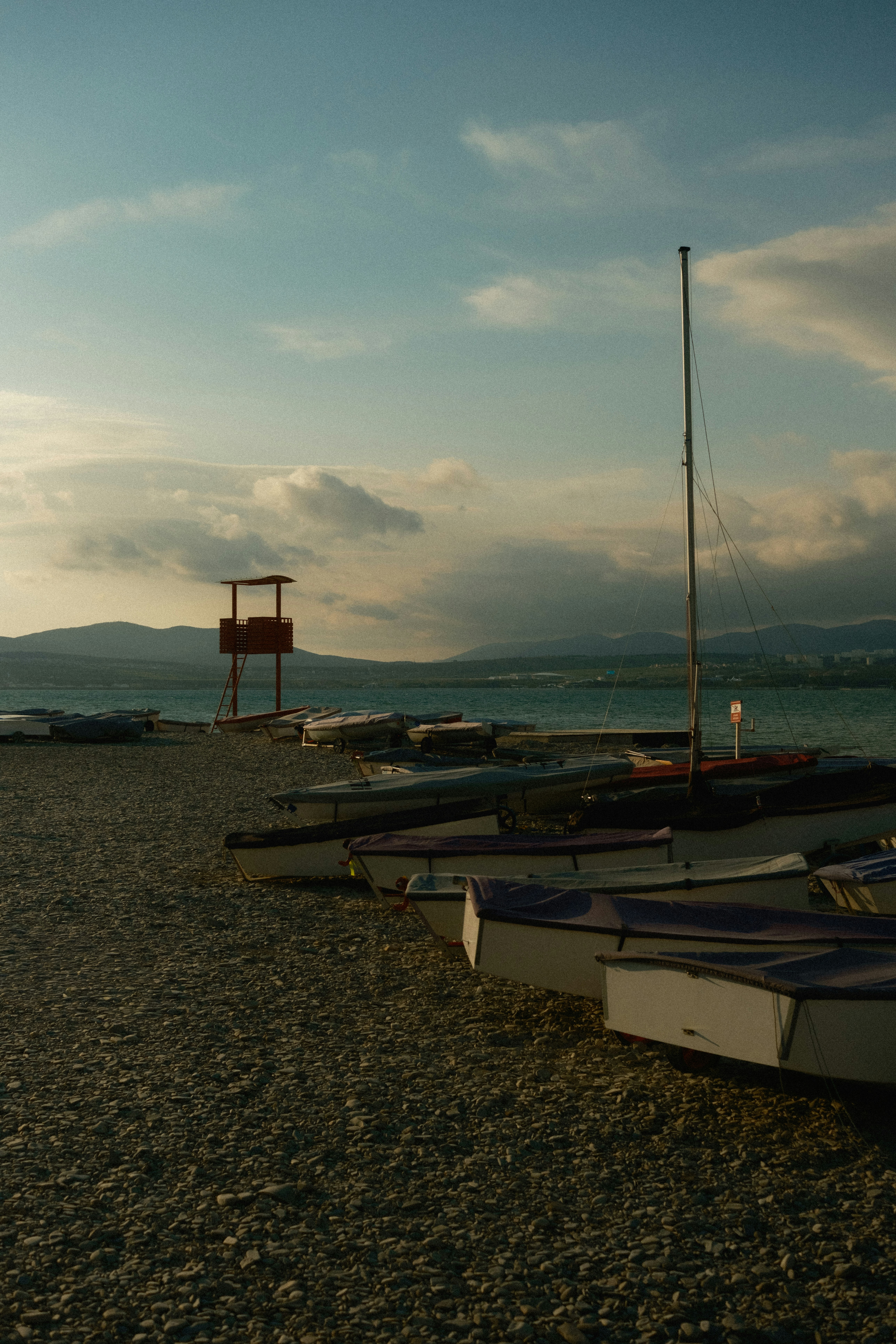 Marina on the Pebble Shore at Dusk