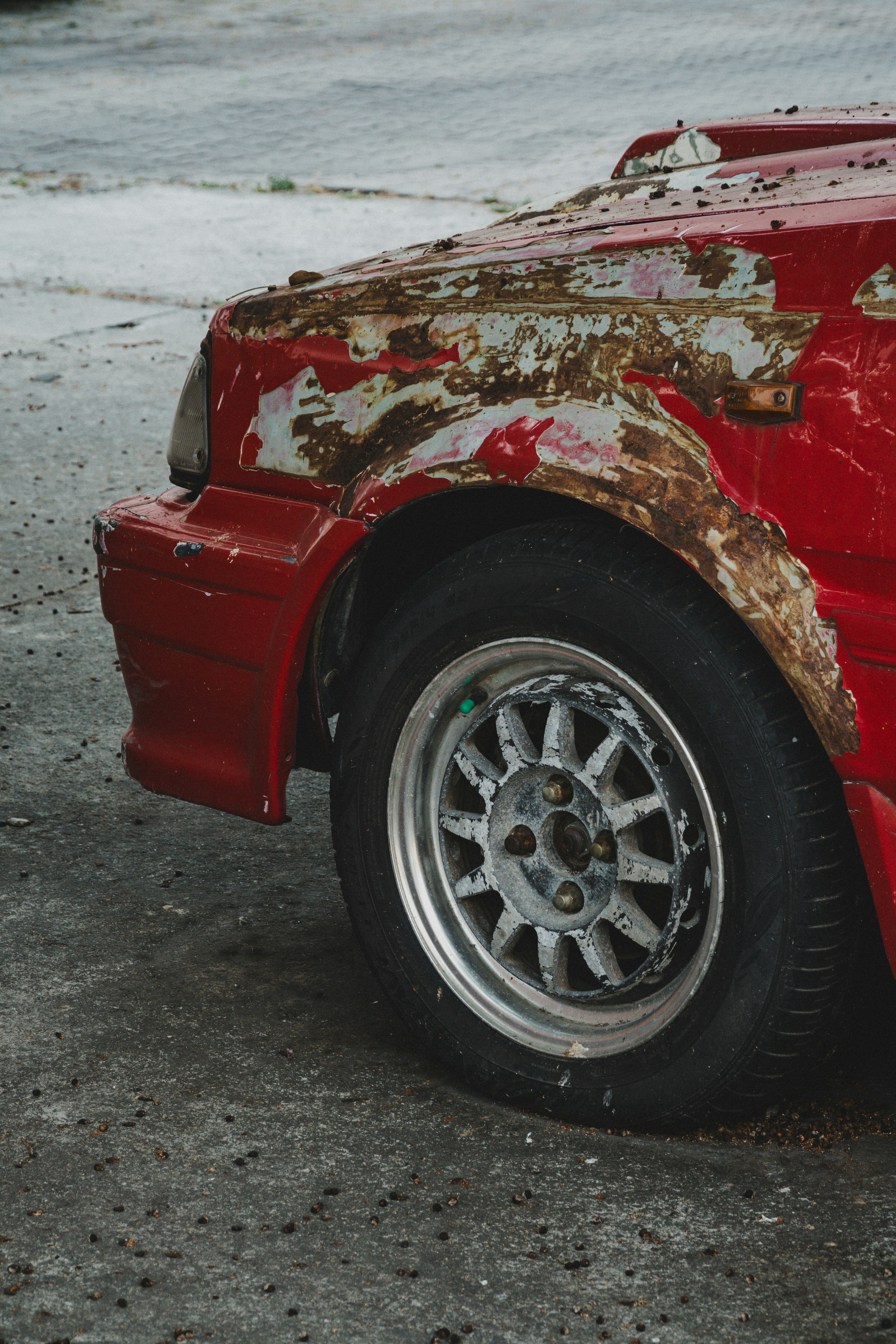 Weathered Red: A Classic Car's Battle with Time