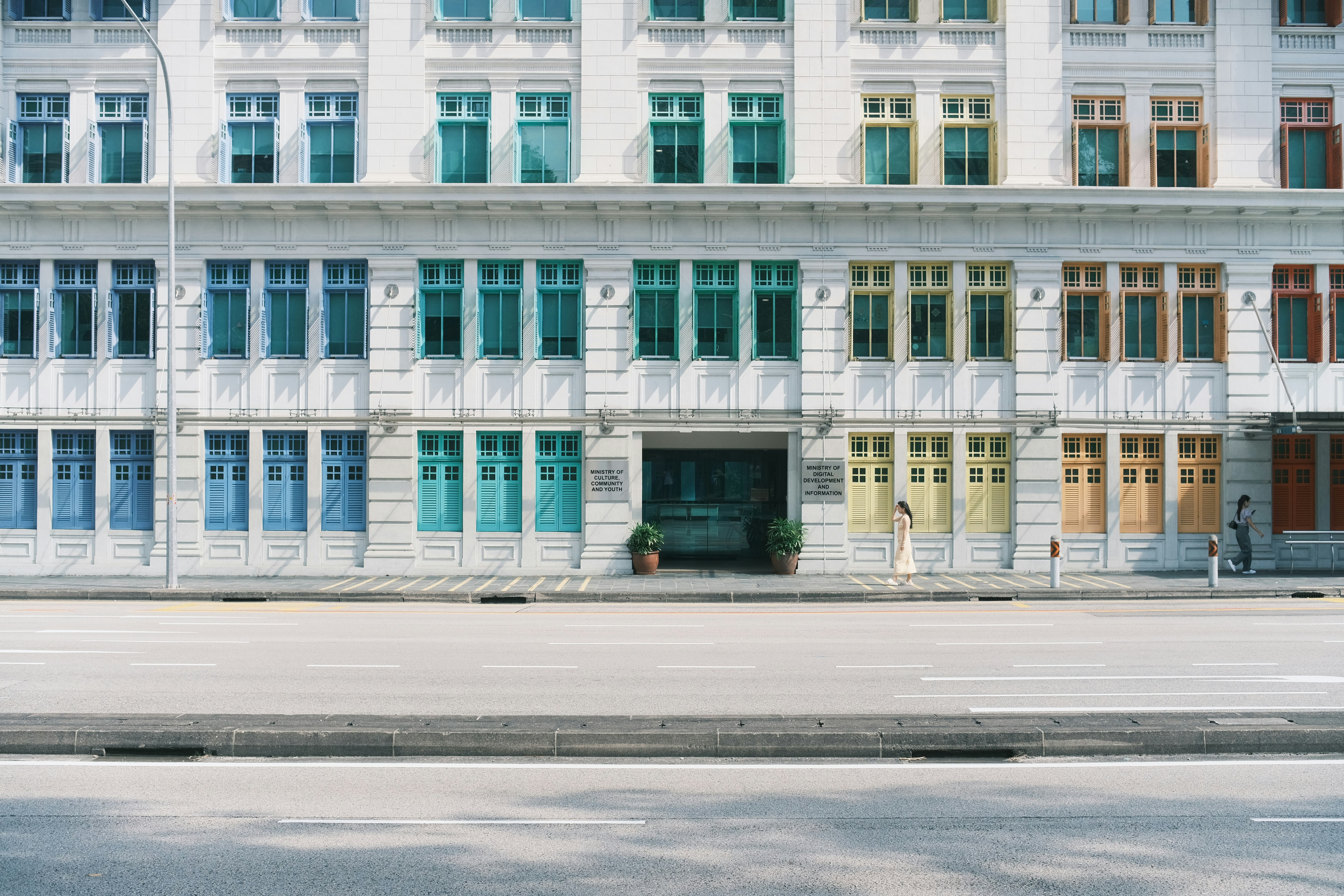 Pastel Facades: A Quiet Row of Painted Doors