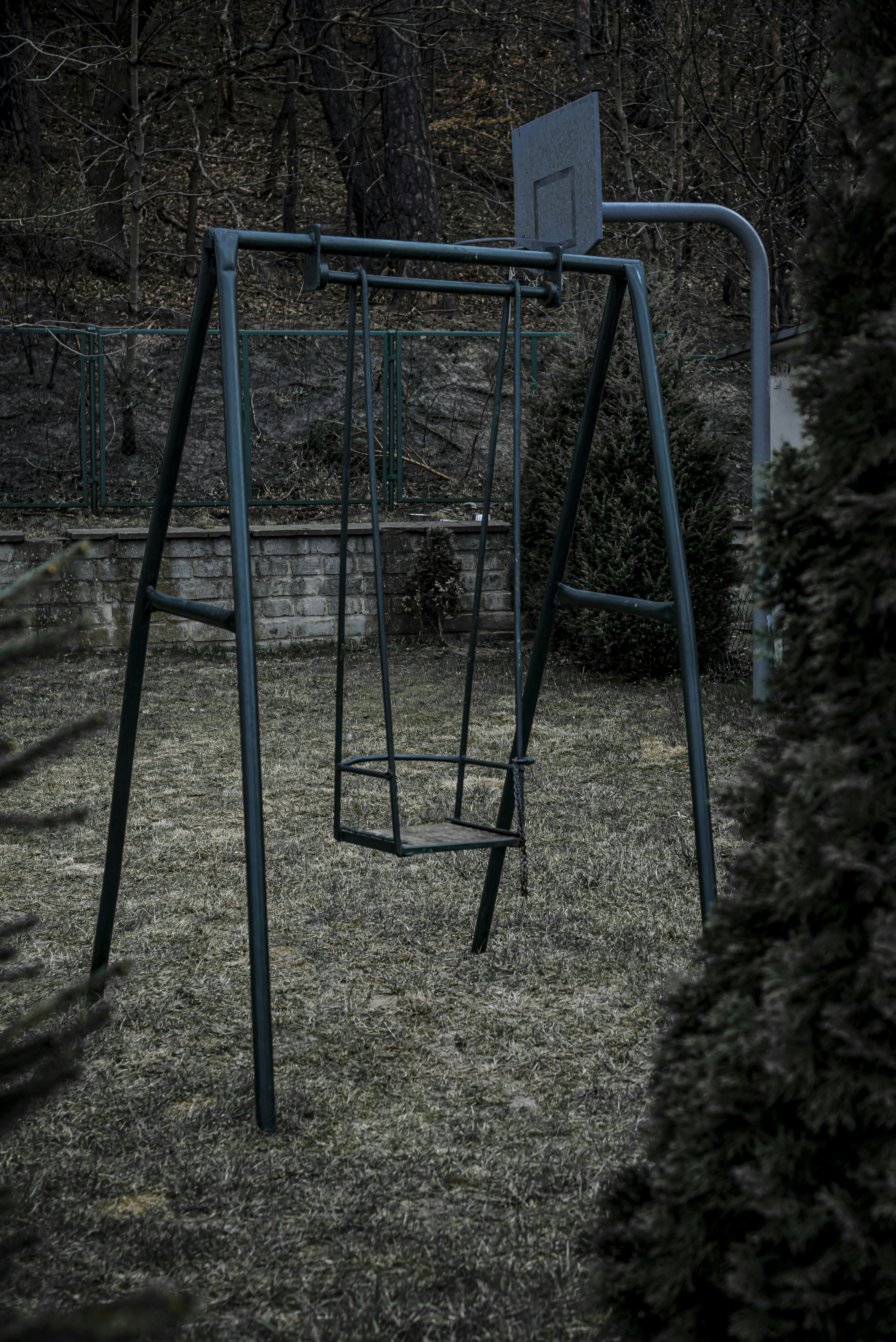 Desolate Playground Swing Bathed in Dusk