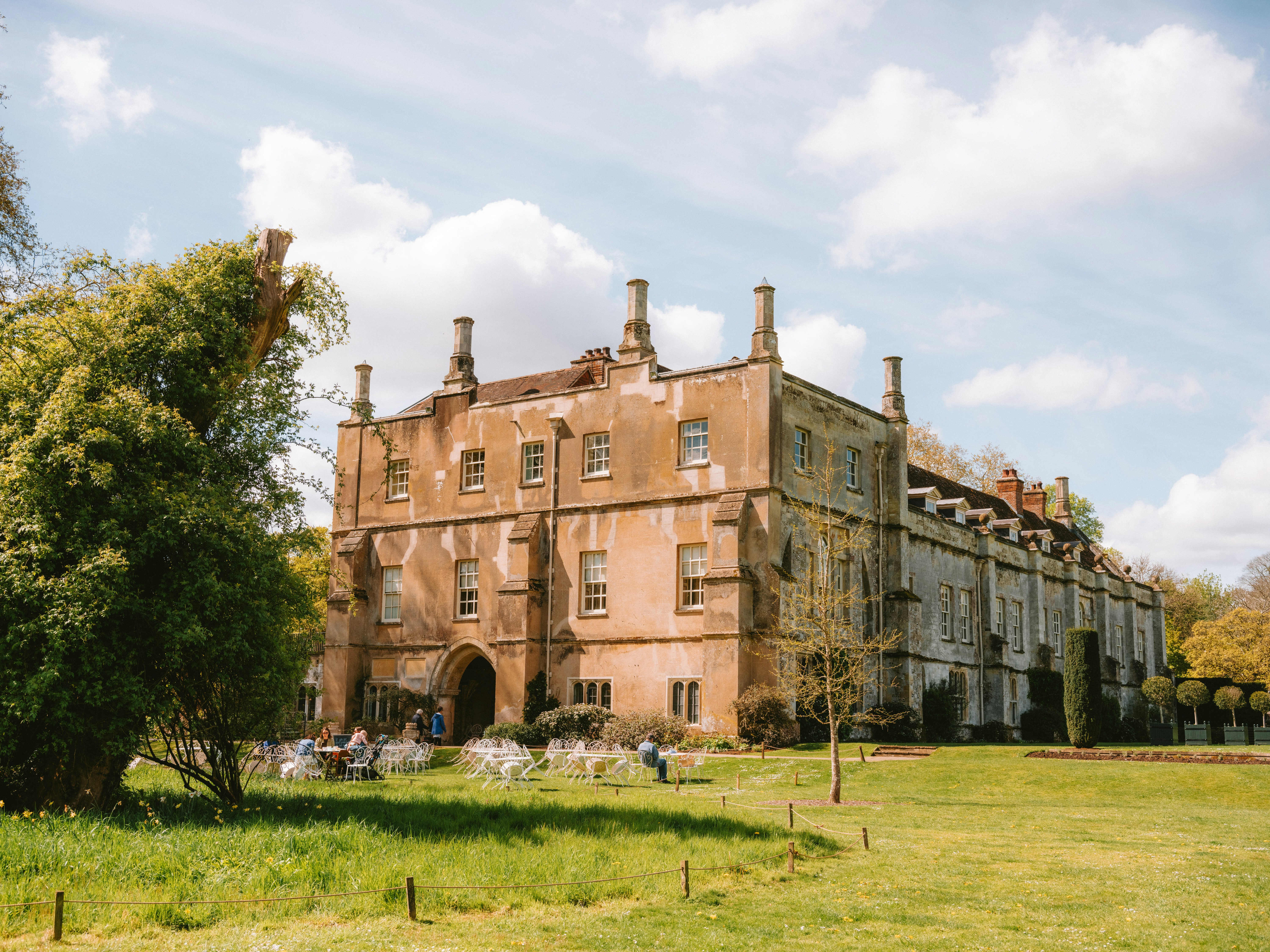 Amber Facade of the Manor Glowing Under a Summer Sky