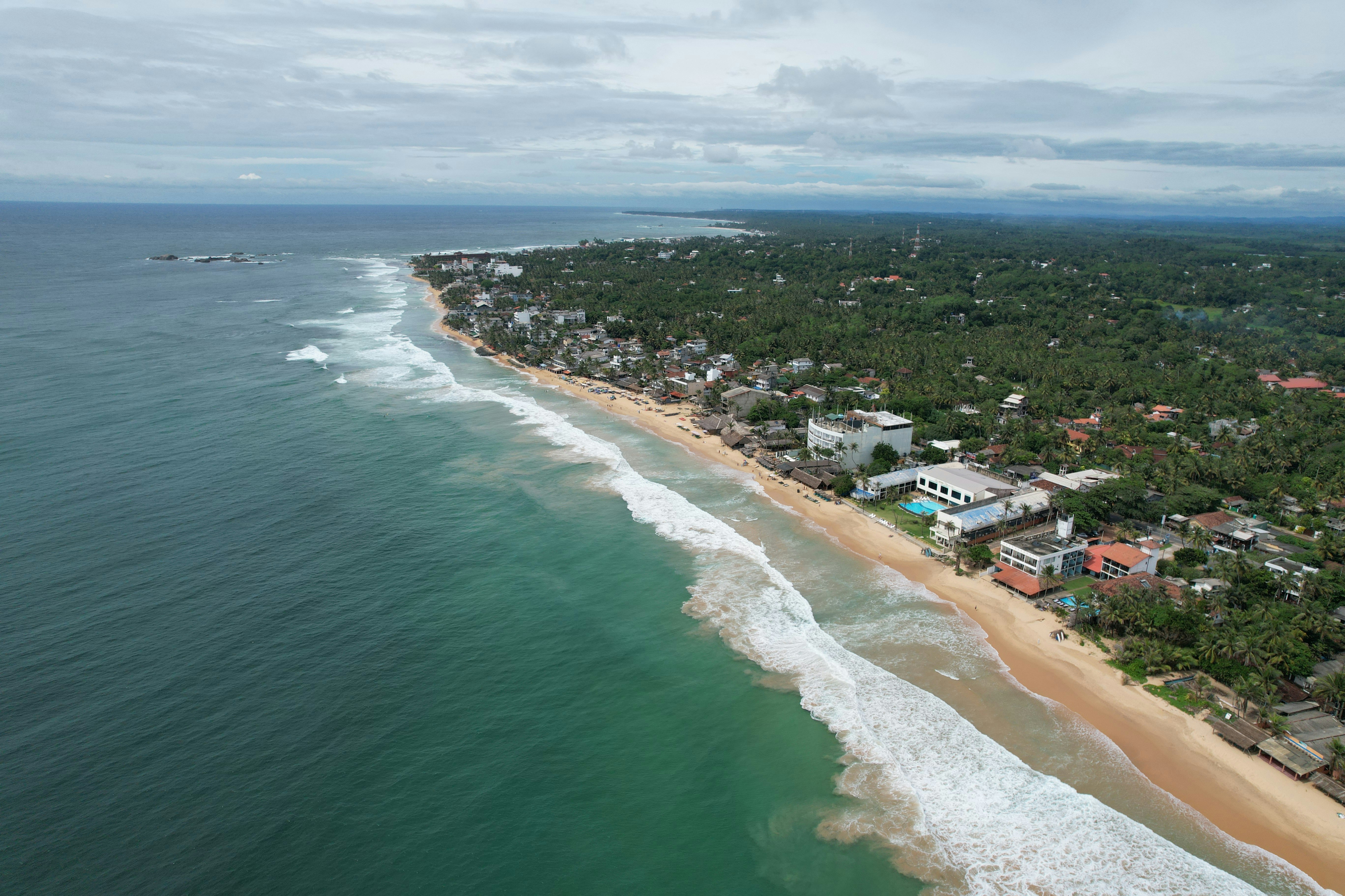 Coastal Ribbon: Beachfront Homes Along a Turquoise Sea