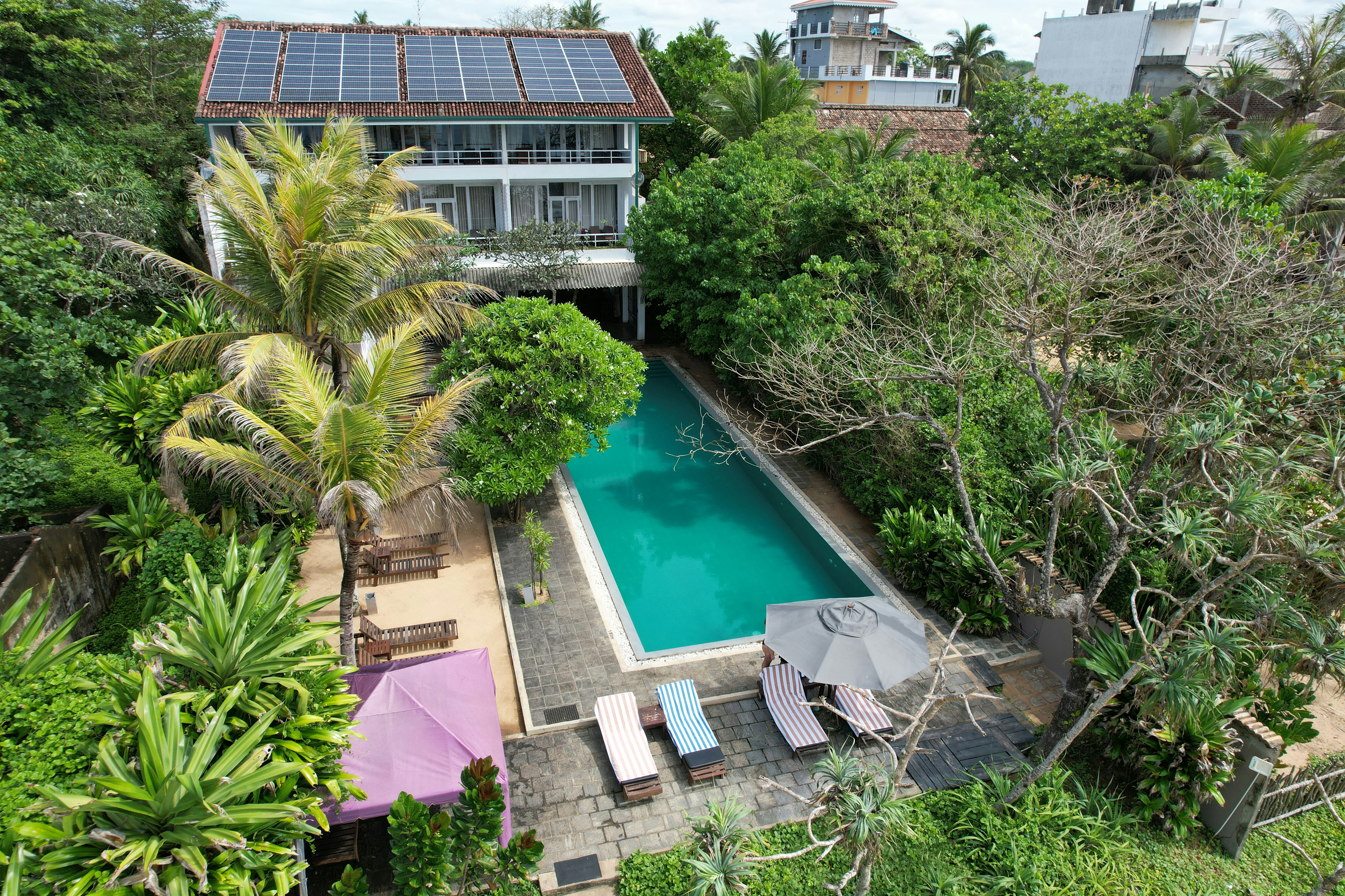 A tranquil villa pool tucked among lush tropical foliage
