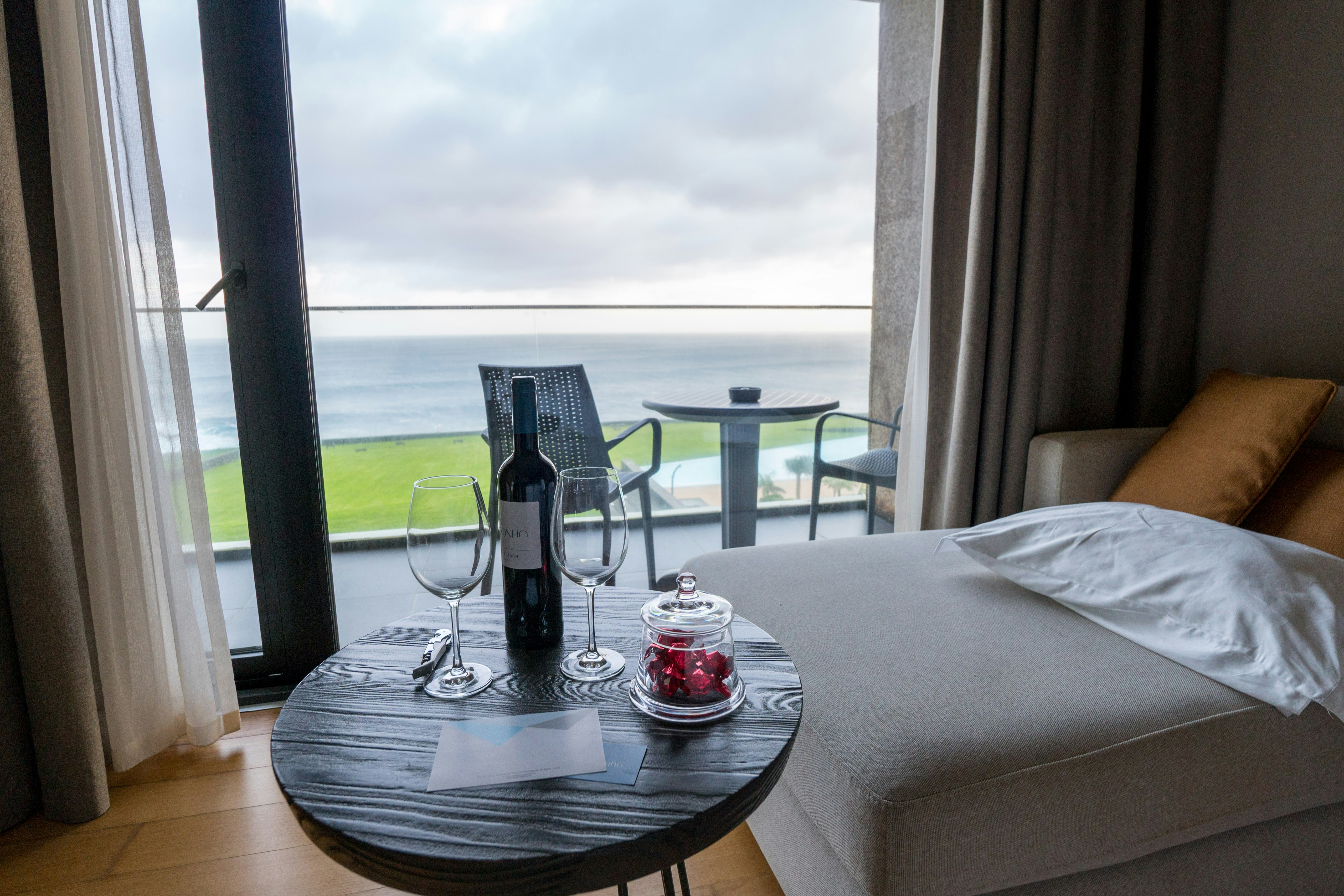 Balcony Table for Two: Wine, Glasses and Nightly View