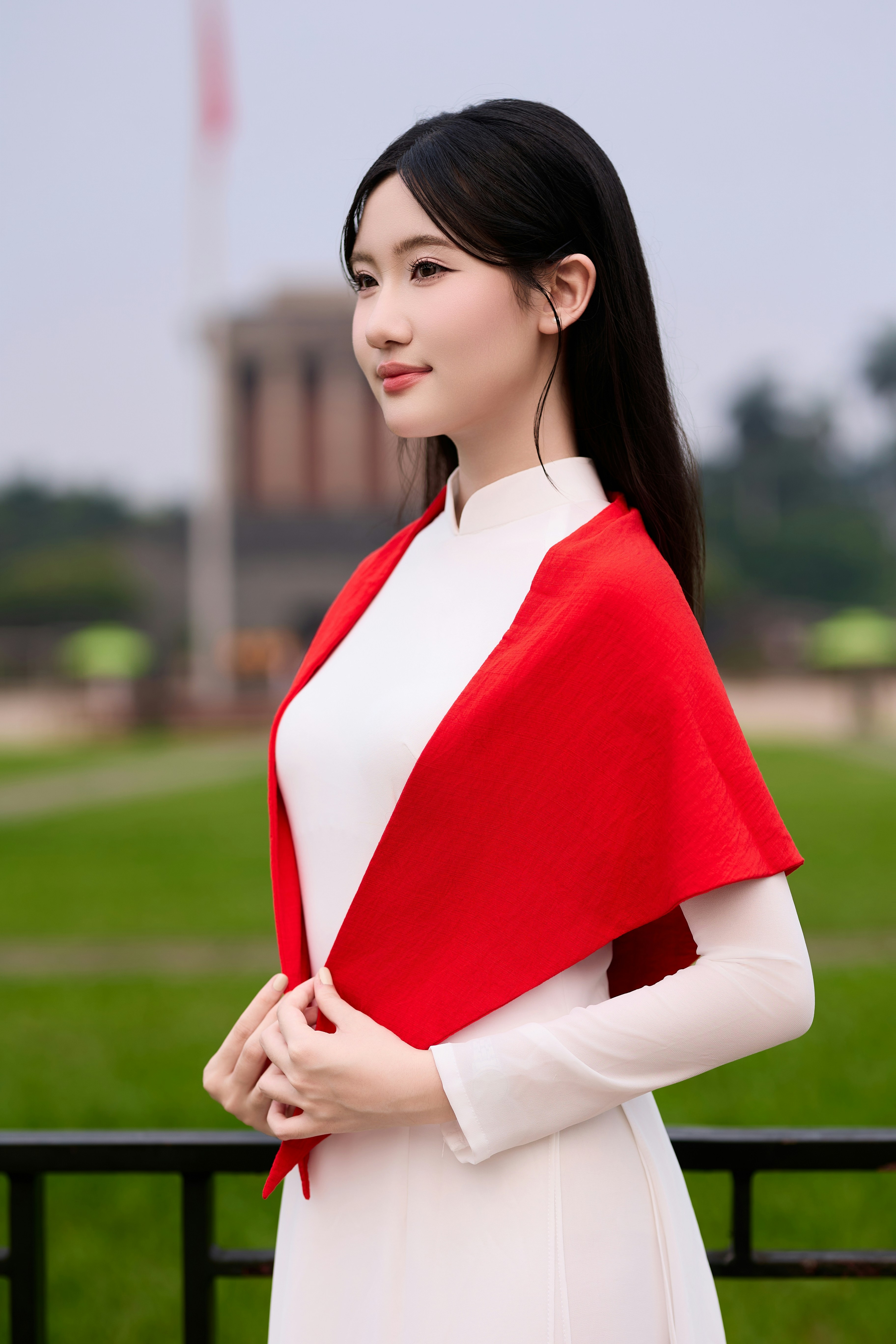 Graceful Portrait in Red: A Poised Moment in the Park