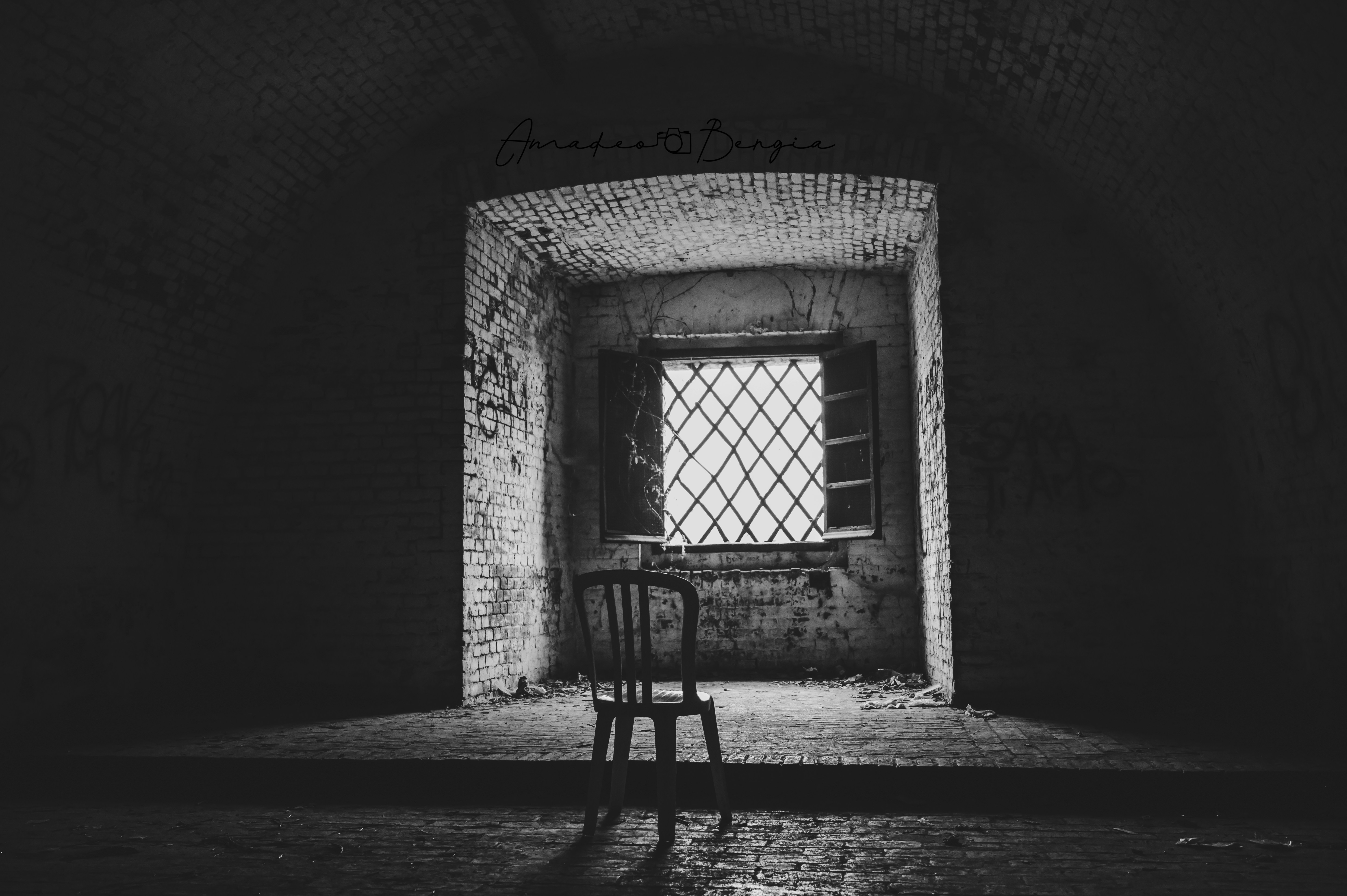 Echoes in the Window: A Lone Chair in a Dim Brick Passage