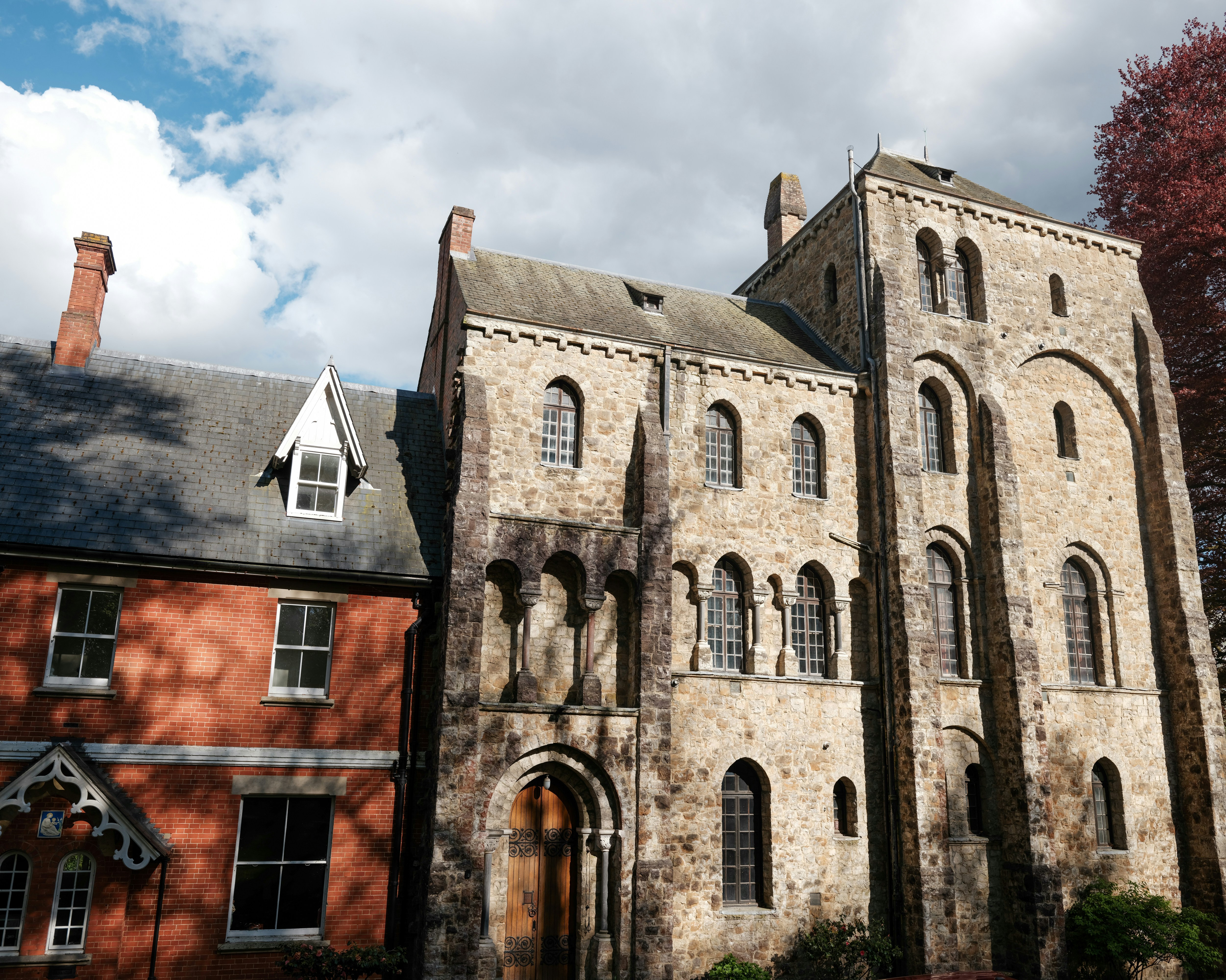 Stone Cathedral: A Sunlit Facade Adorning Time-worn Brick and Archways