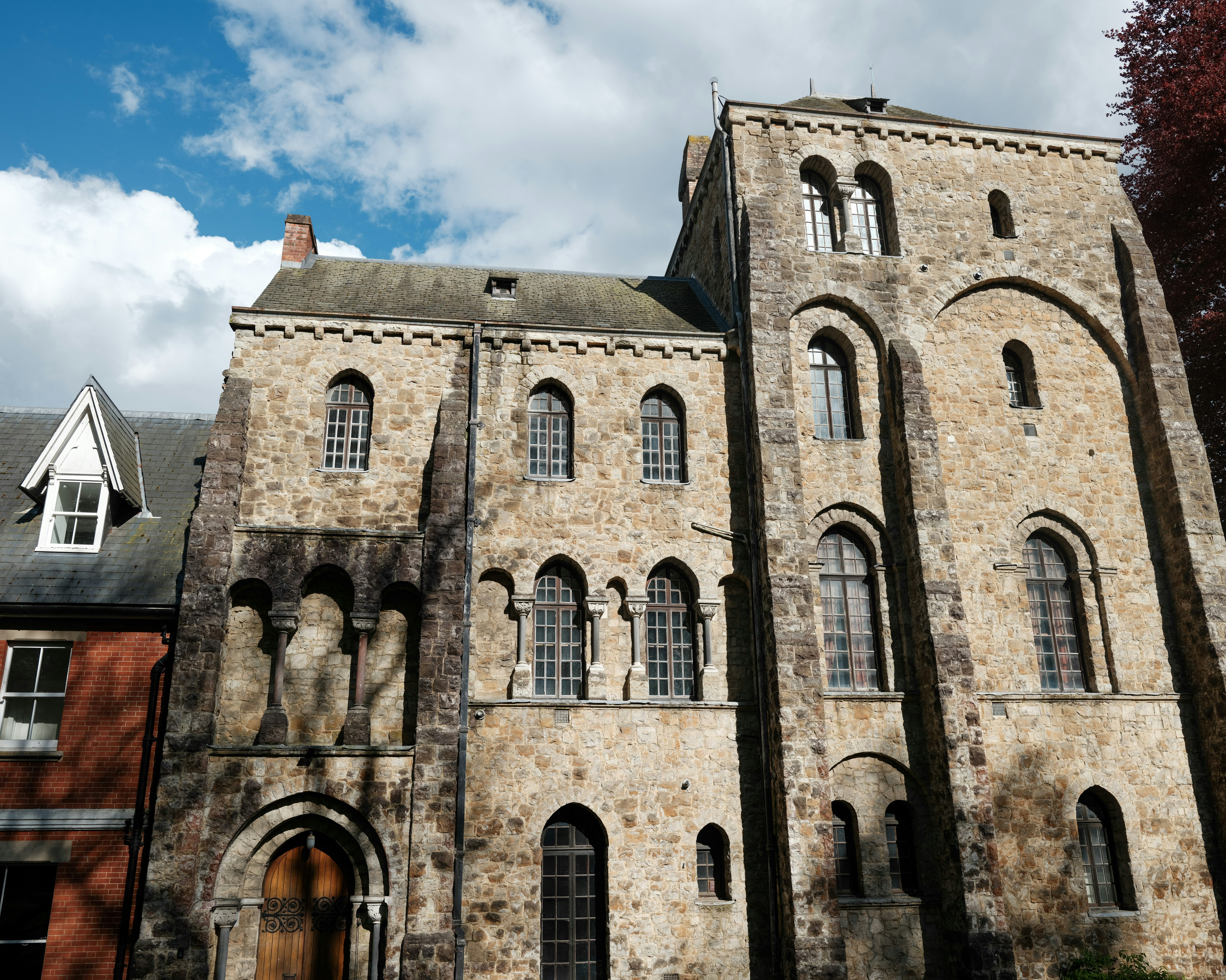 Old Fortress in Stone: A Sunlit Facade of Arched Windows