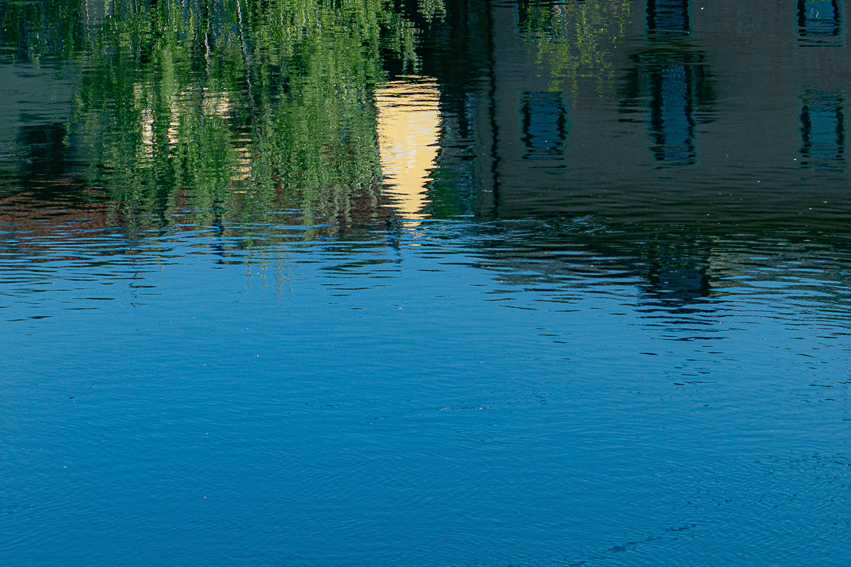 Blue Reflections Along a Quiet Waterfront