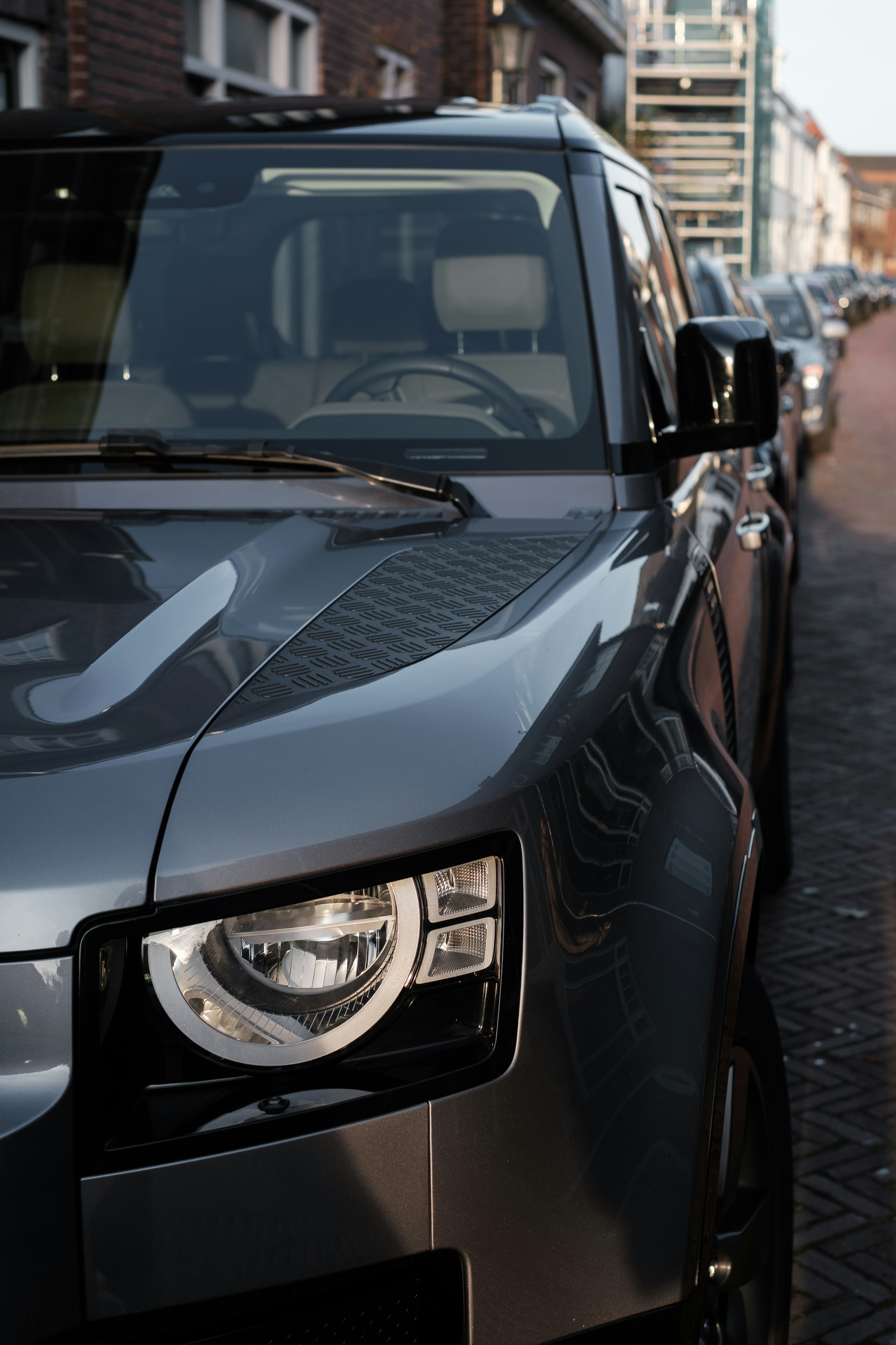 Front-Fender Quietude: A Silver SUV Anchors a Quiet Street