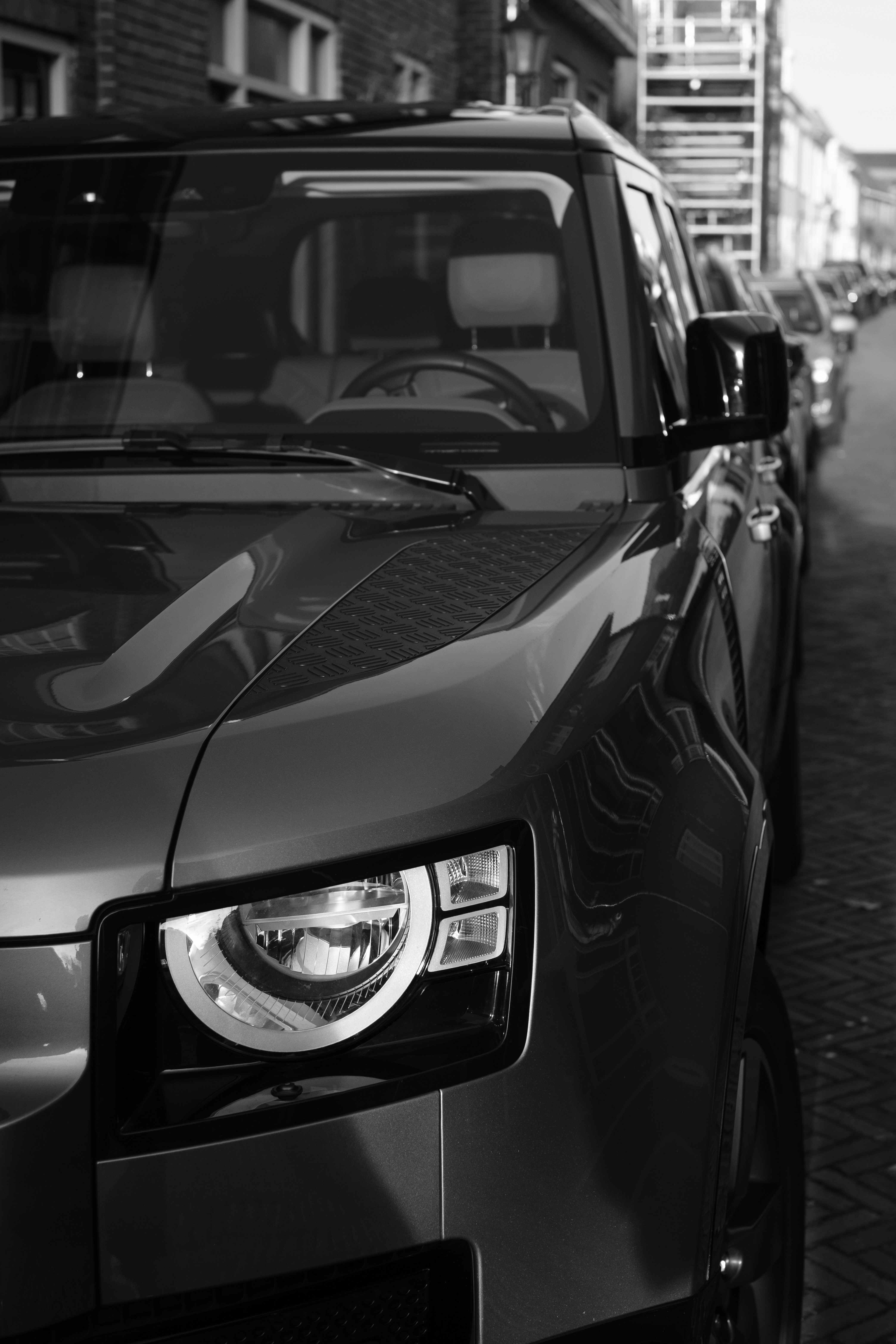 Front-Quarter Gleam: A City SUV Streaks Down the Street