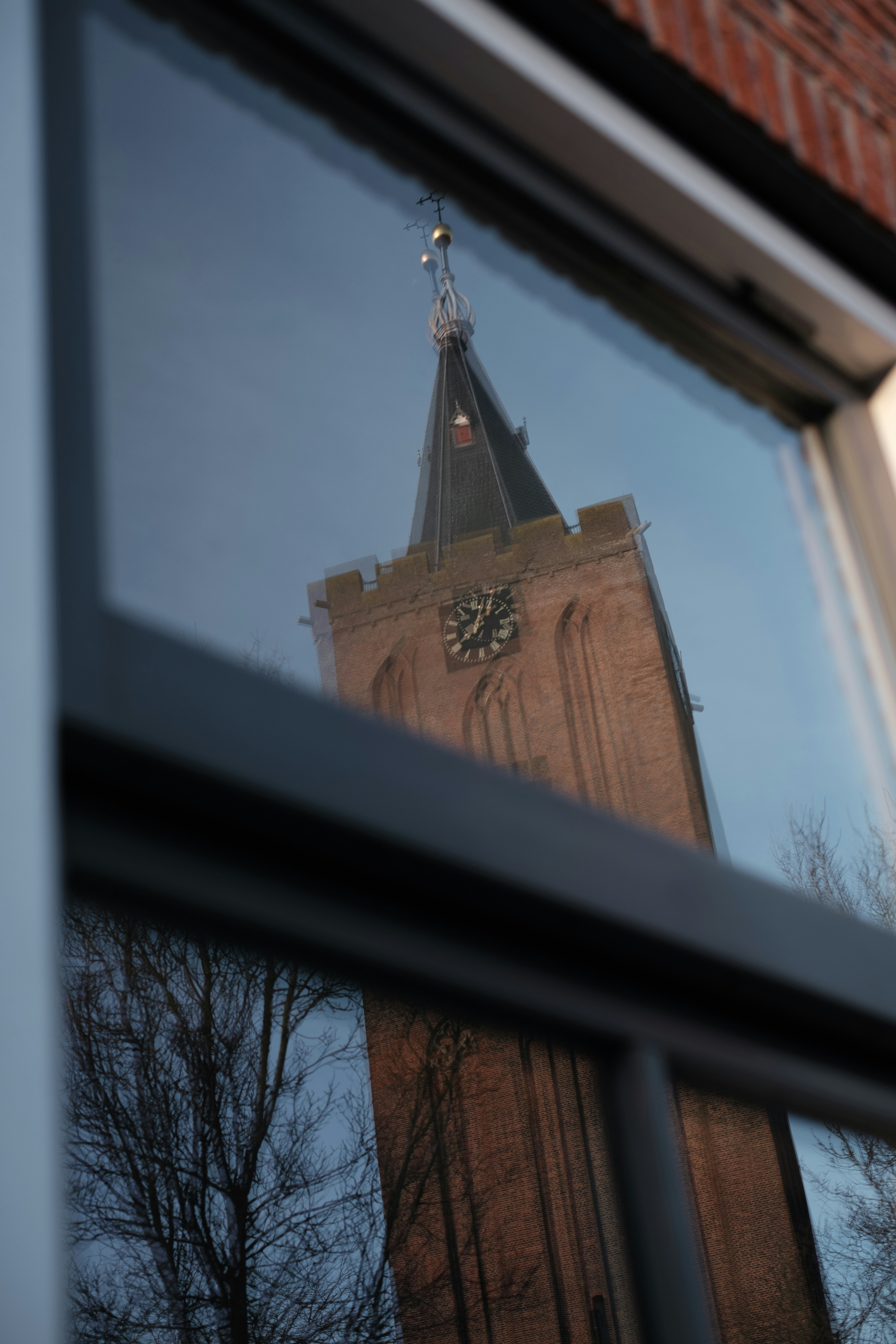 Clock Tower Through a Window: A Quiet Reflection