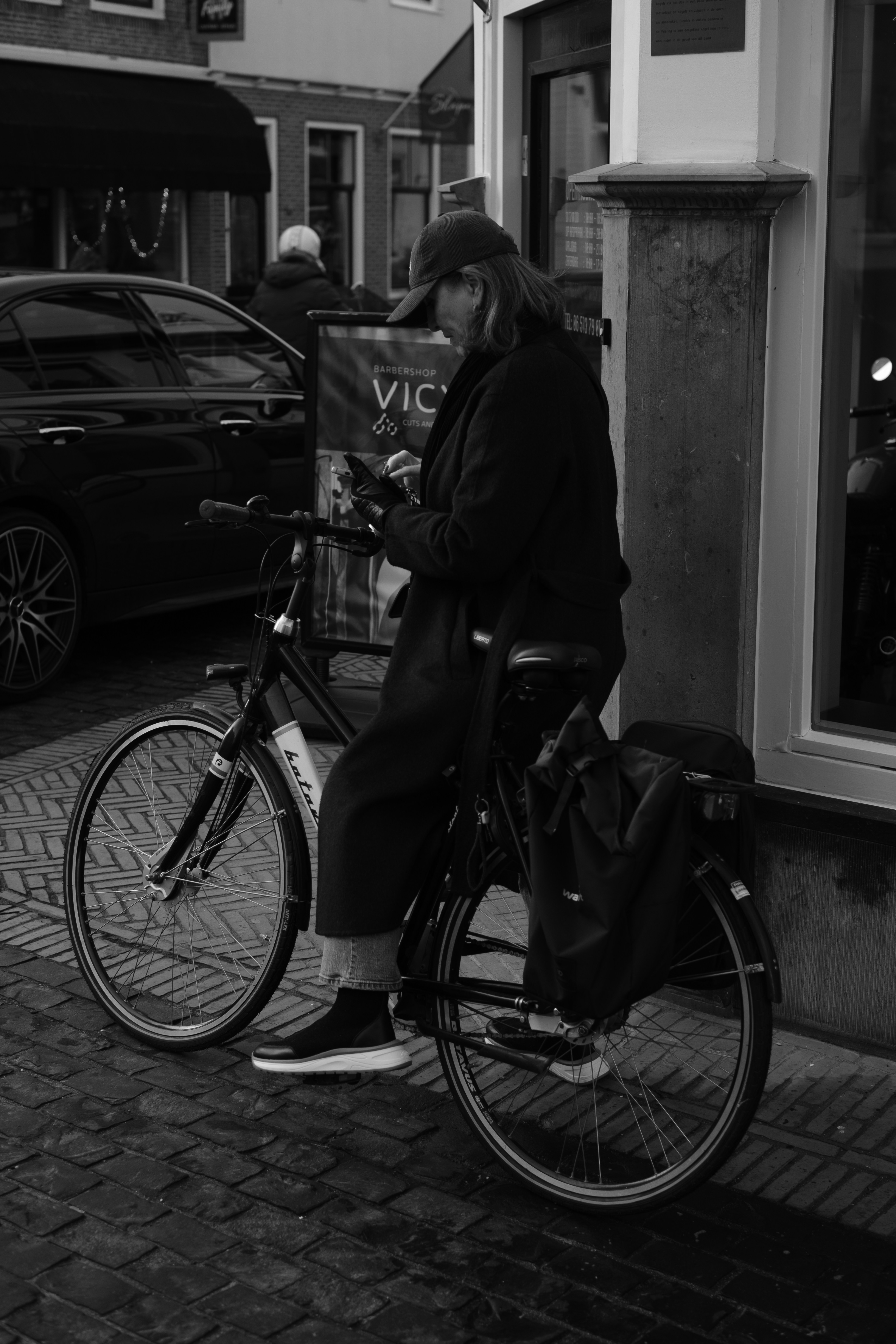 Evening Pause: A Solo Rider Checks the Street with Quiet Intention