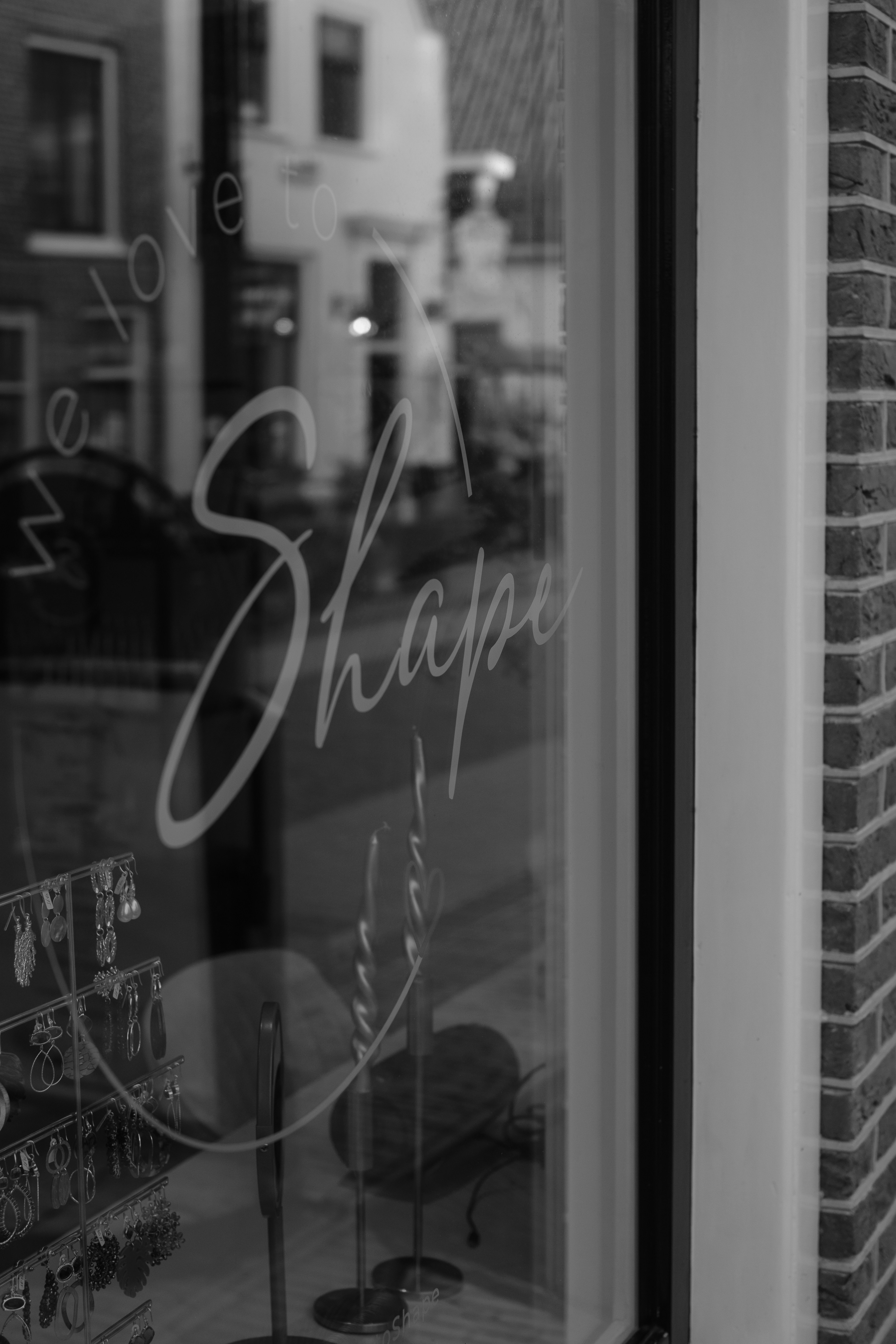 Glassfront Window Script: Reflections and Jewelry in a Monochrome Shop