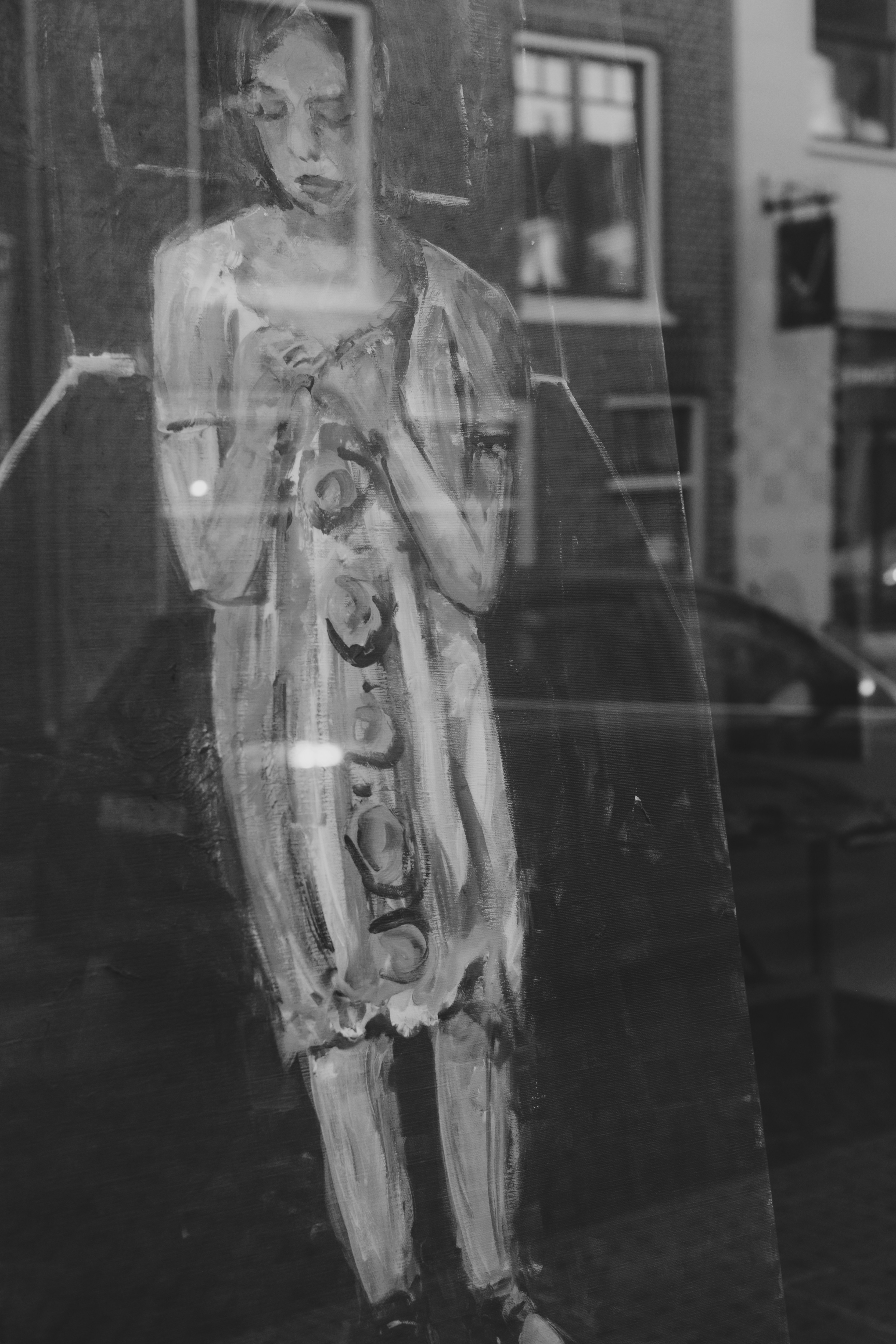 Veiled Portrait in the Glass: A Painted Figure within a Street Window