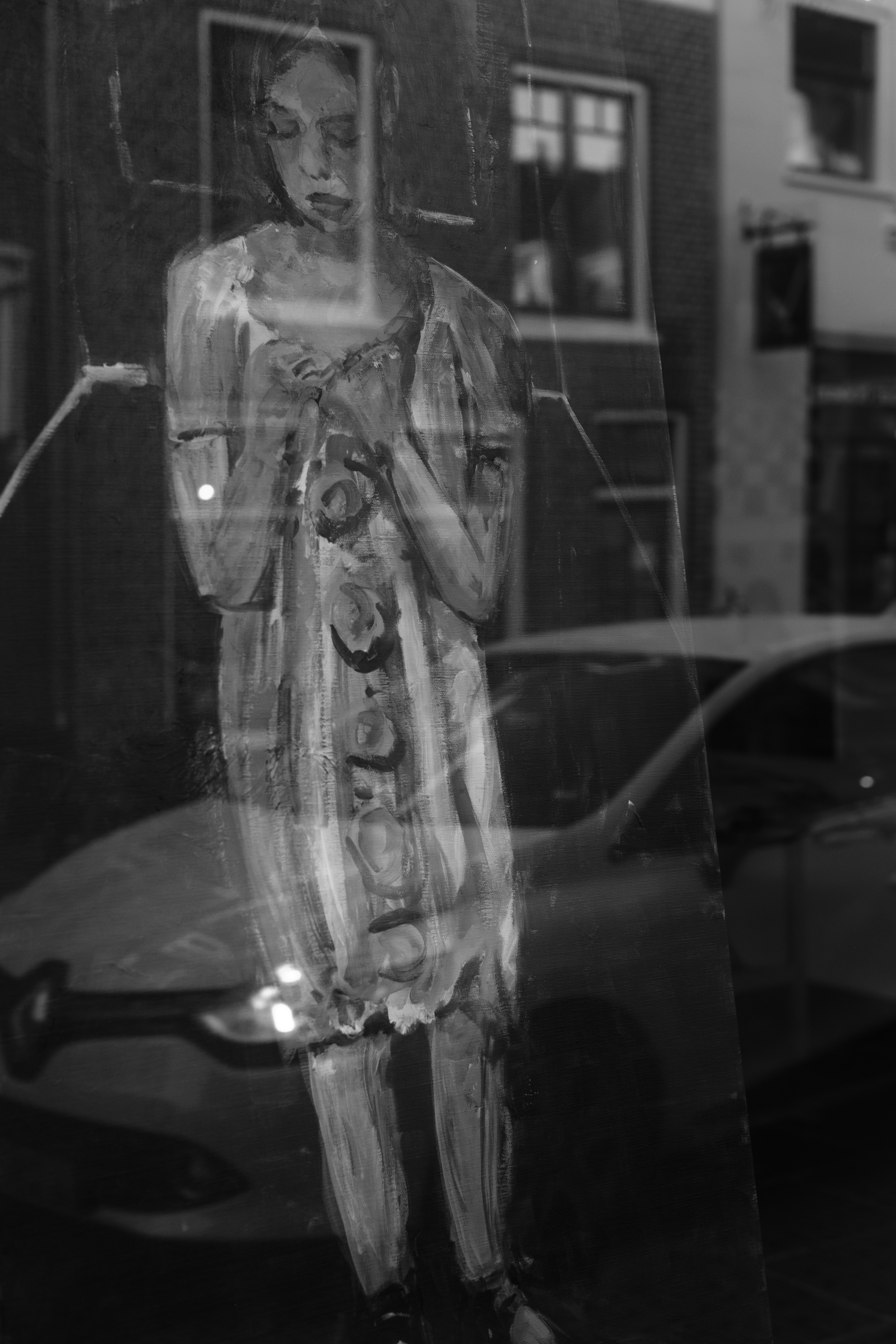 Echoes of a Glass Portrait: A Monochrome Figure in Window Reflections